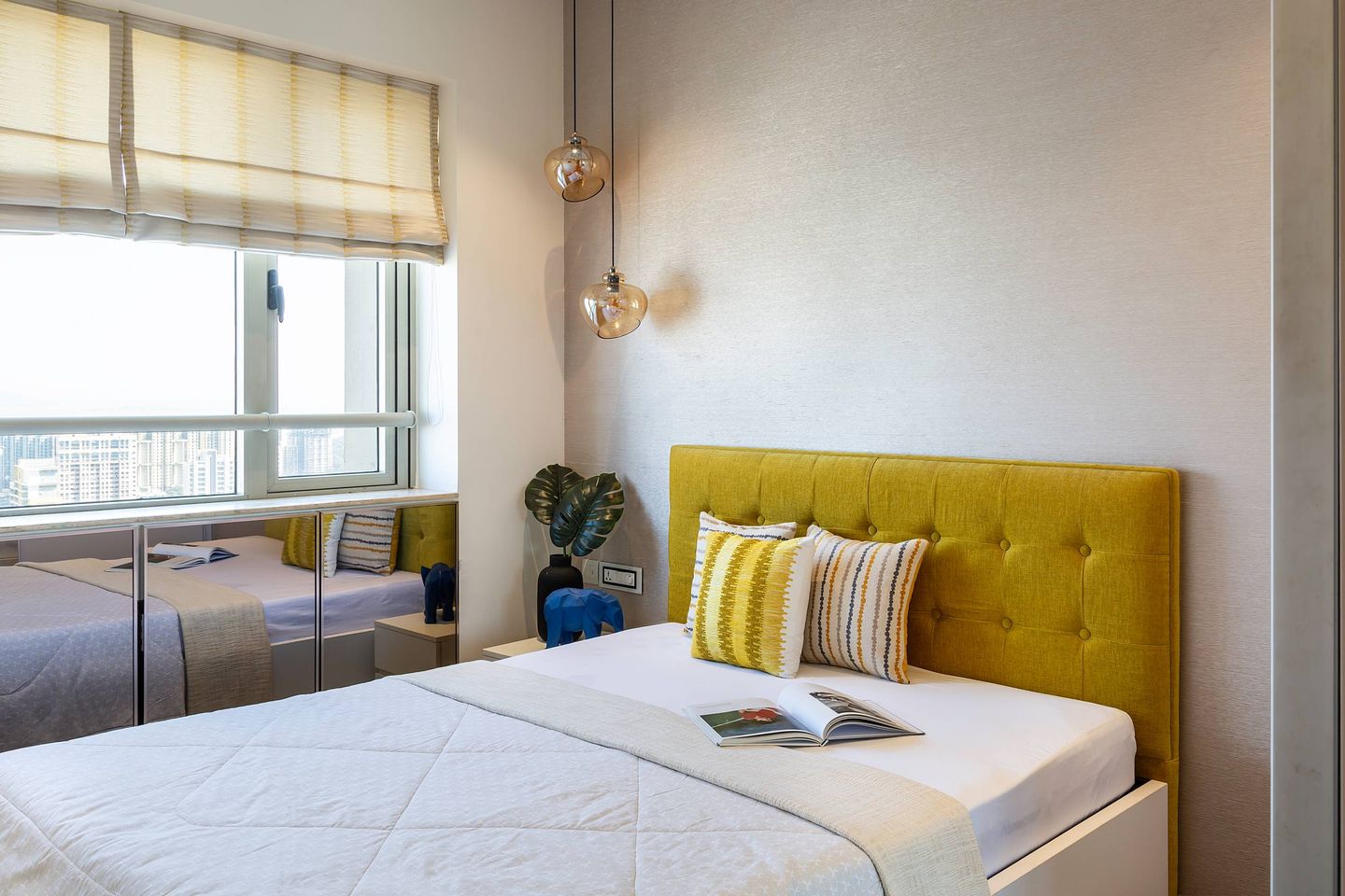 Compact Guest Room Design With Mustard Yellow Headboard | Livspace