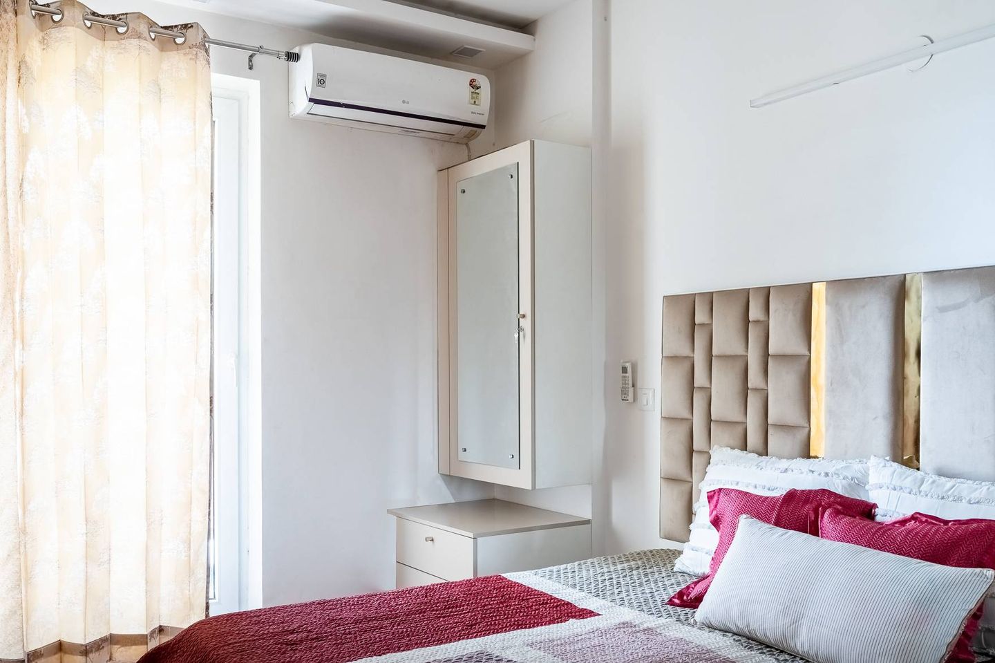 Spacious Guest Room Design With Velvet Headboard | Livspace