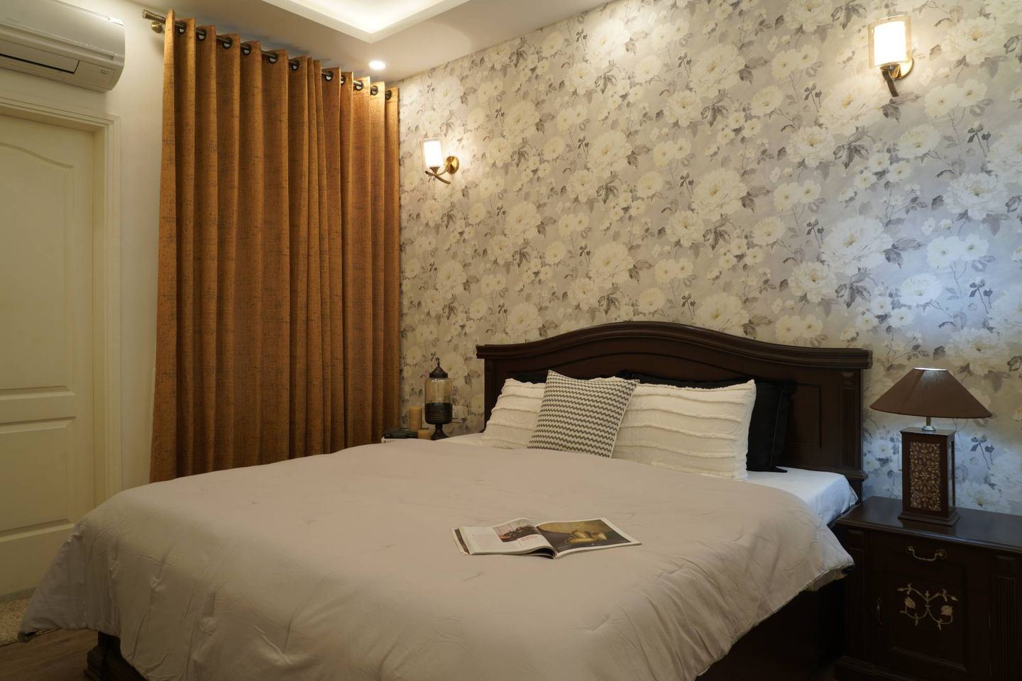 Compact Guest Bedroom Design With Floral Wallpaper | Livspace