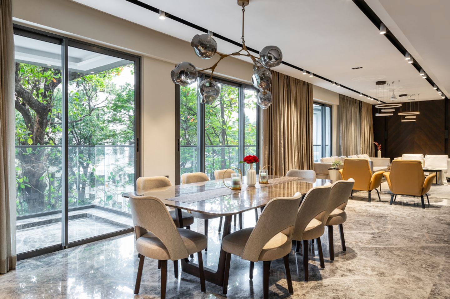 Spacious 8-Seater Dining Room With A Chandelier | Livspace