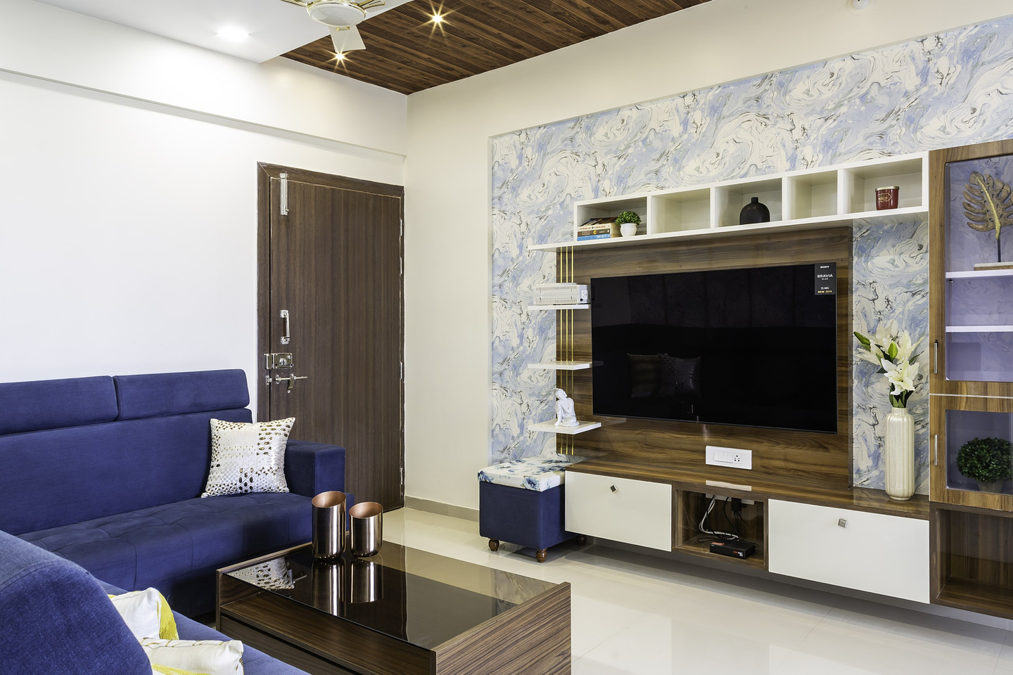 Central Drop False Ceiling Design With Dark Wooden Rafter And Cove ...