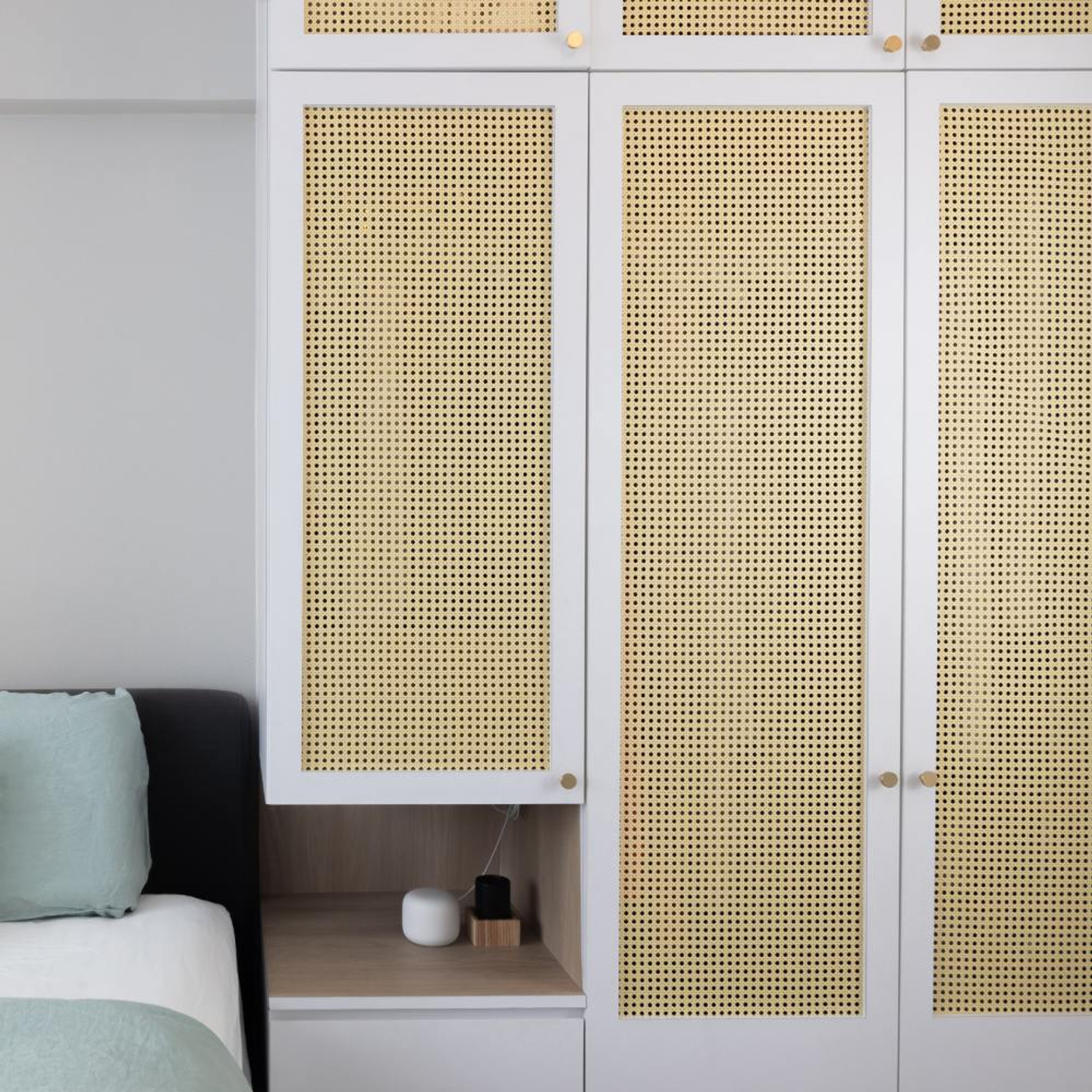 Compact Wardrobe Design With Rattan Shutters | Livspace