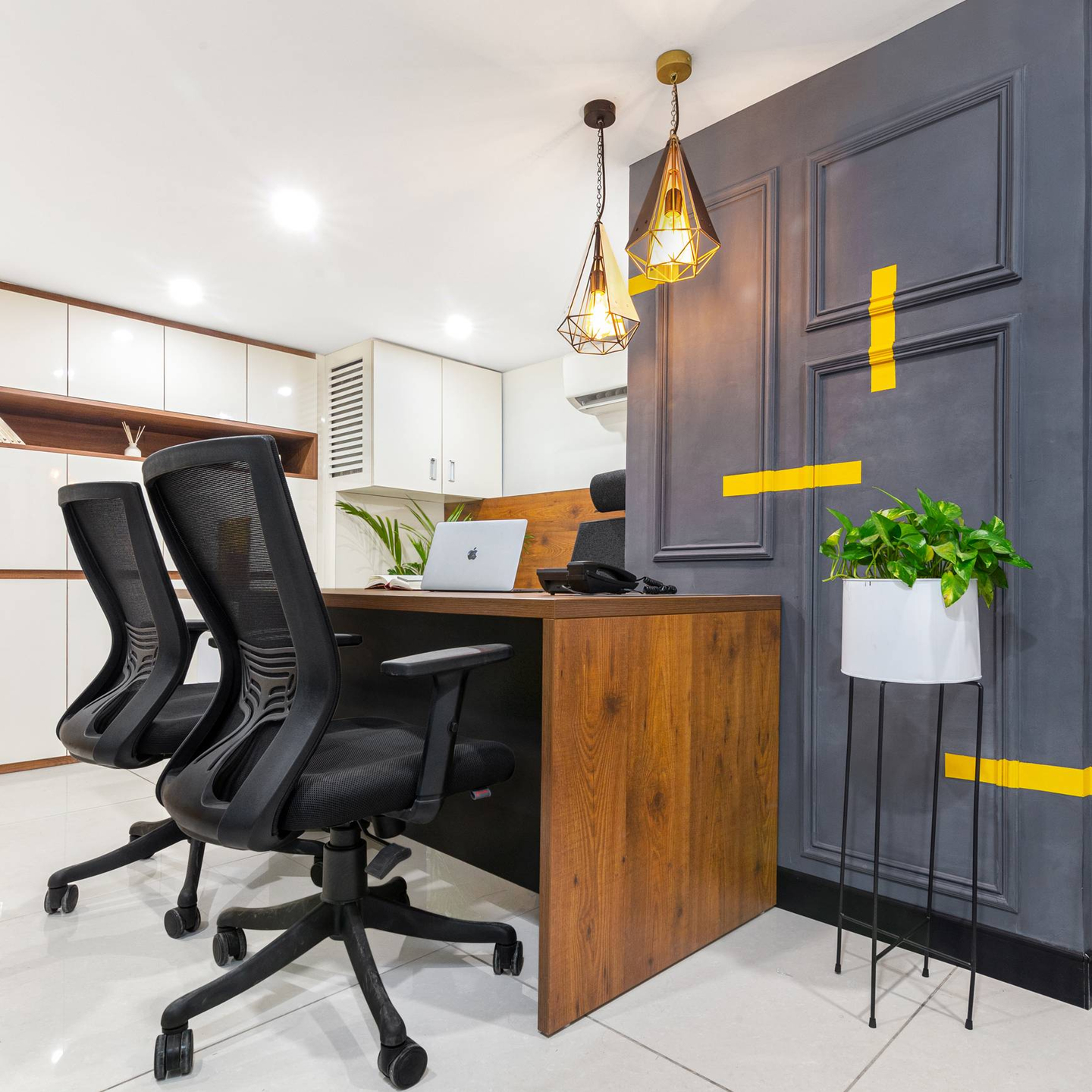Study Room Design With A Wooden Table And Black Chairs | Livspace