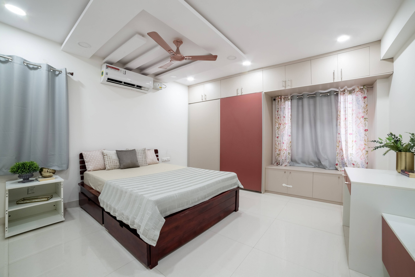 Master Bedroom Design With White And Peach Wardrobe With Loft Storage ...