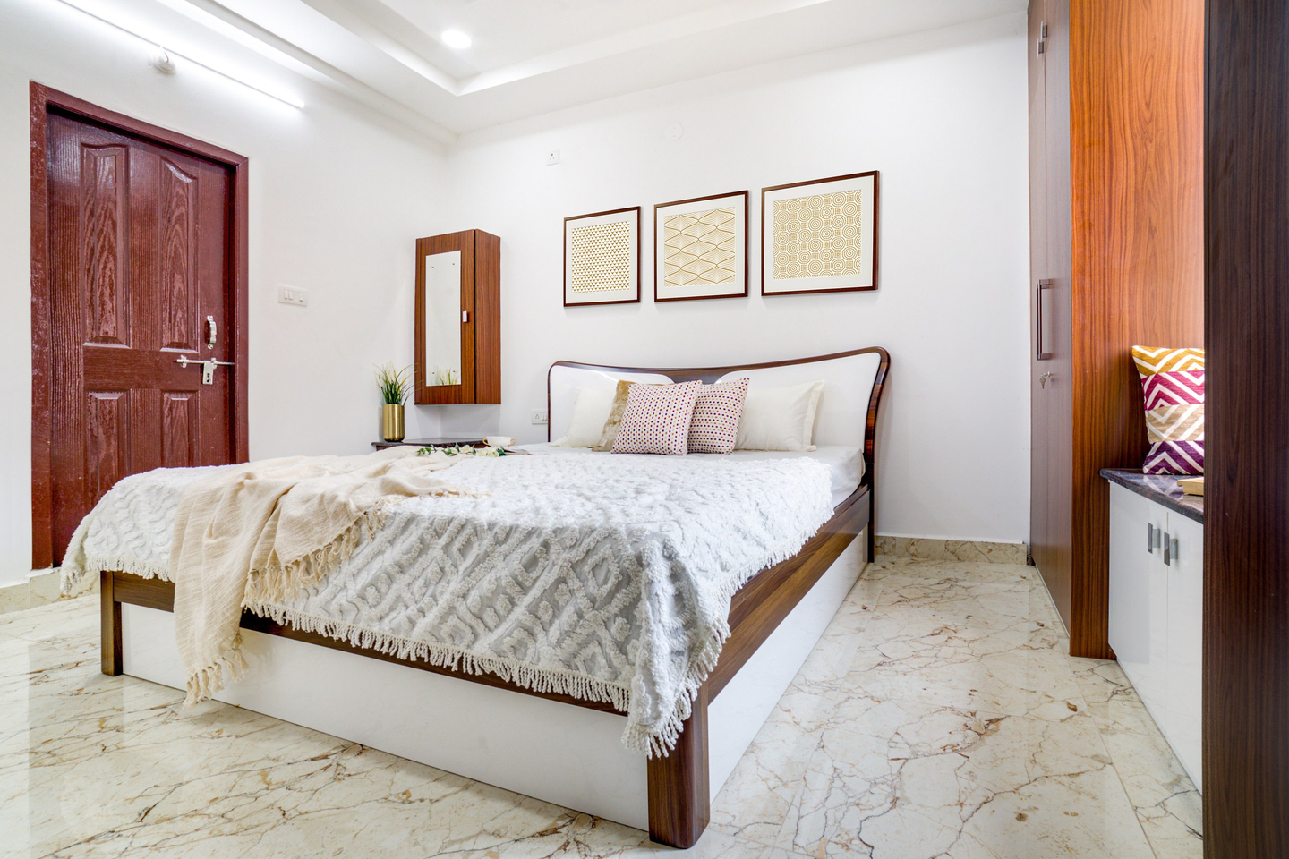 Master Bedroom Design With White Walls And Framed Art Livspace