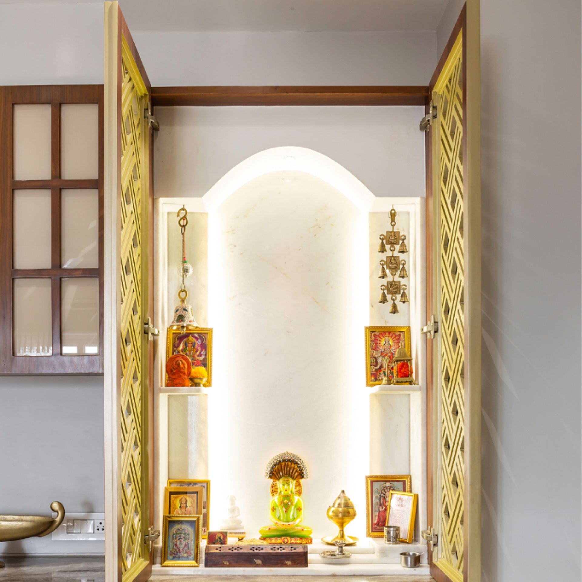 Compact Mandir Design With Frosty White Interiors | Livspace