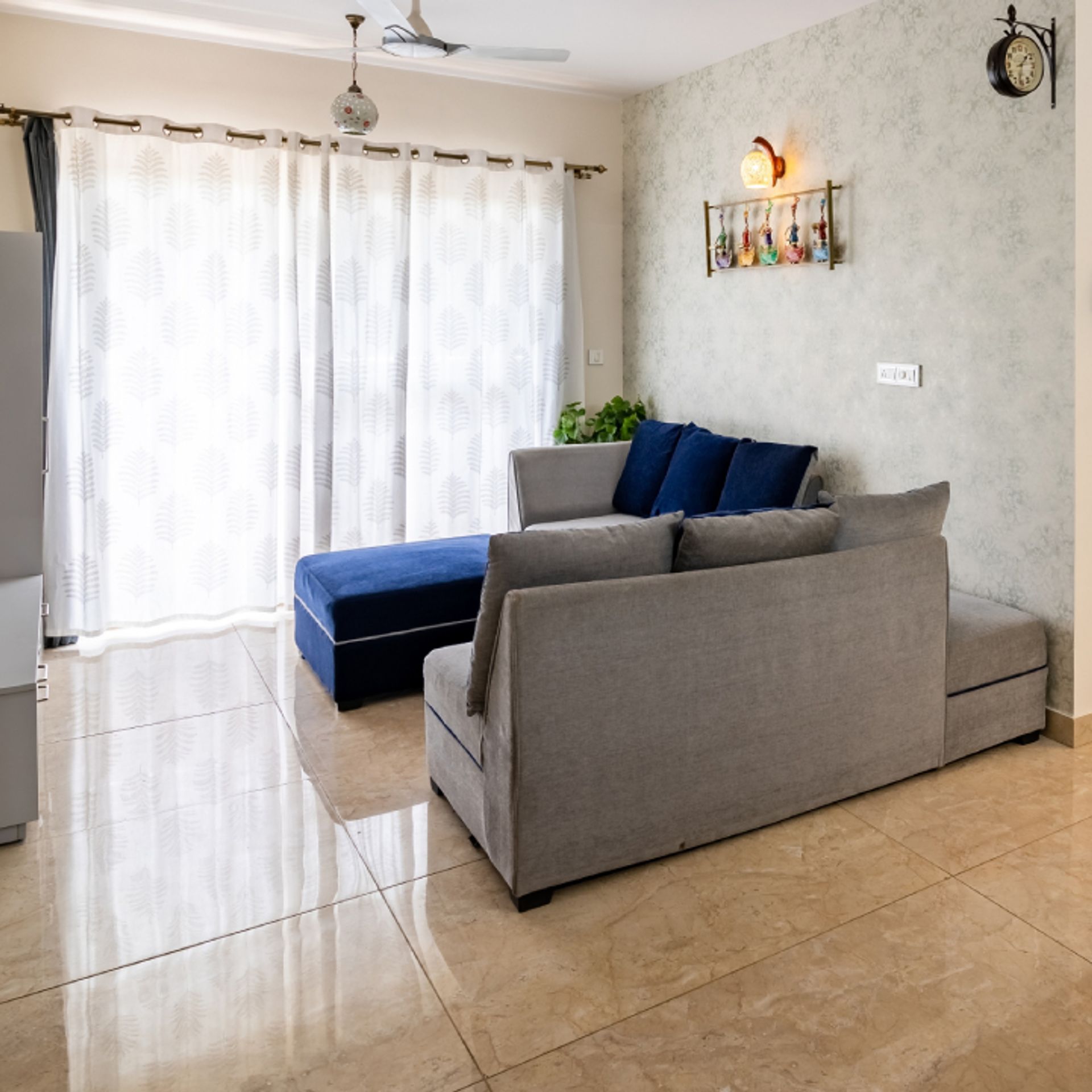 Compact Living Room Tile Design With A Glossy Texture | Livspace