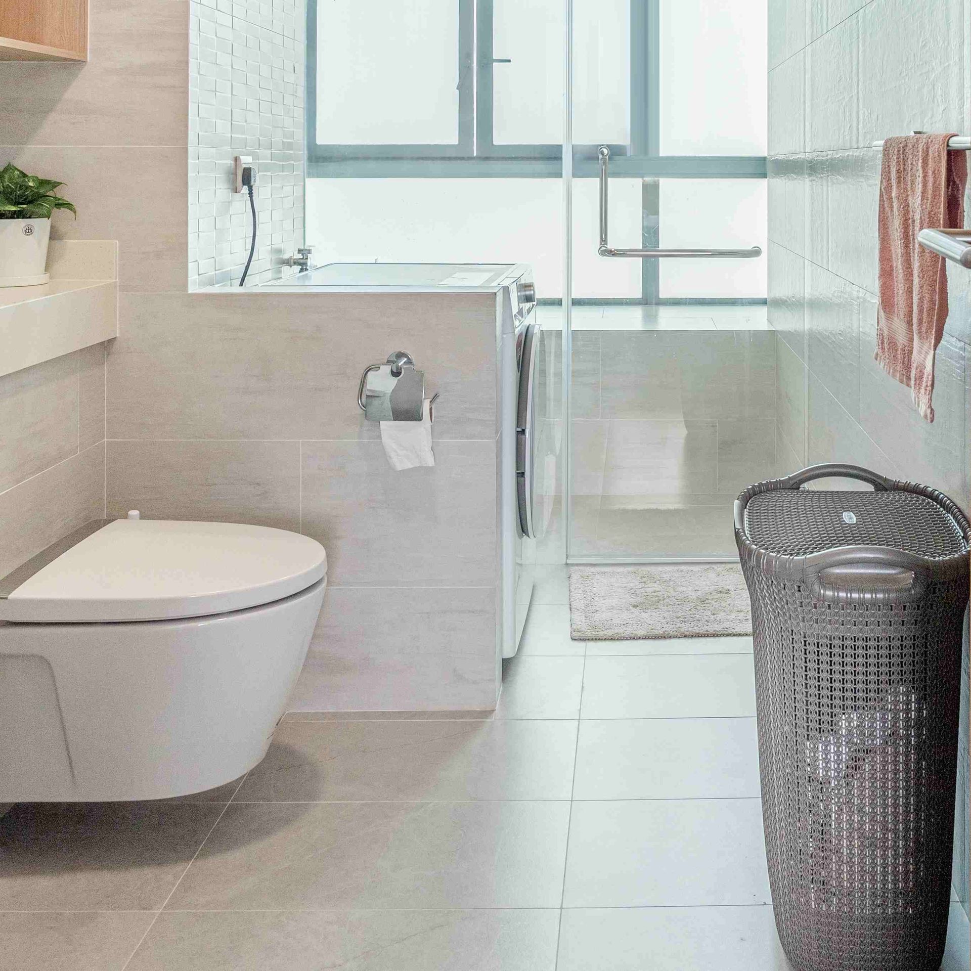 This Scandinavian neutral tone styled tiles design for condos lends a ...
