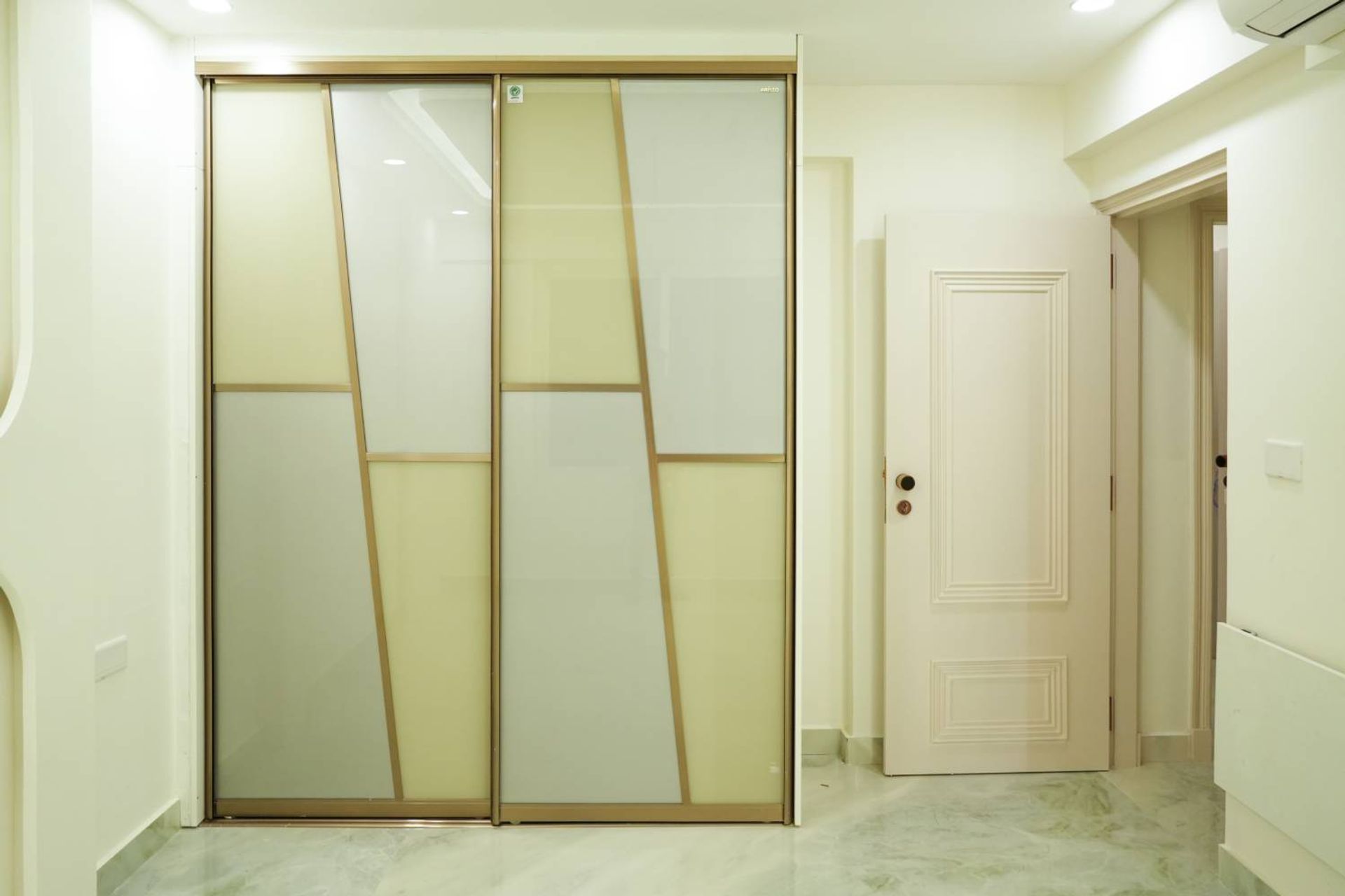 Modern 2-Door Sliding Wardrobe Design with Geometric Panels in White ...