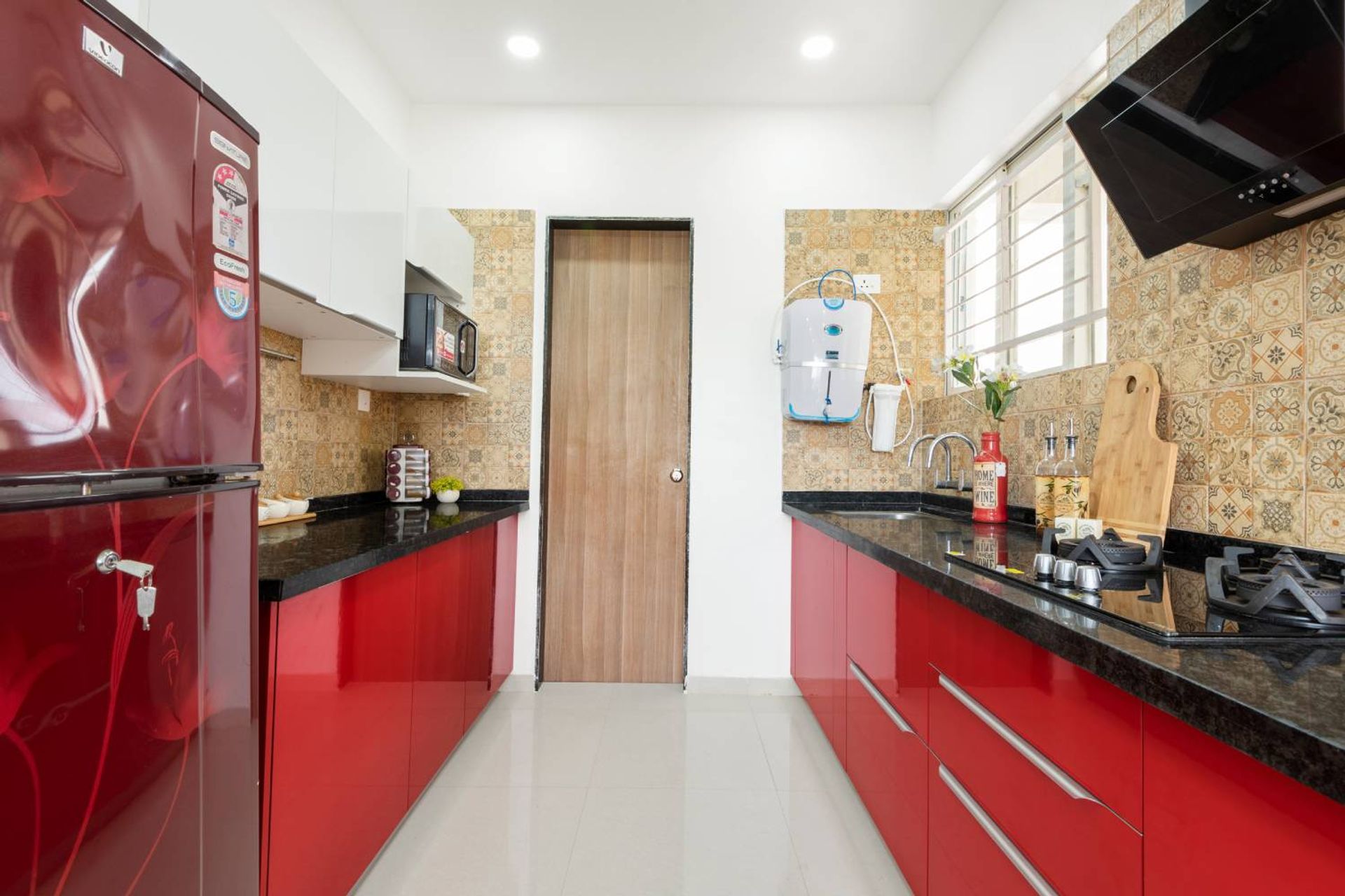 2BHK Contemporary Pune Flat Design Featuring Bold Red Walls and Sliding ...