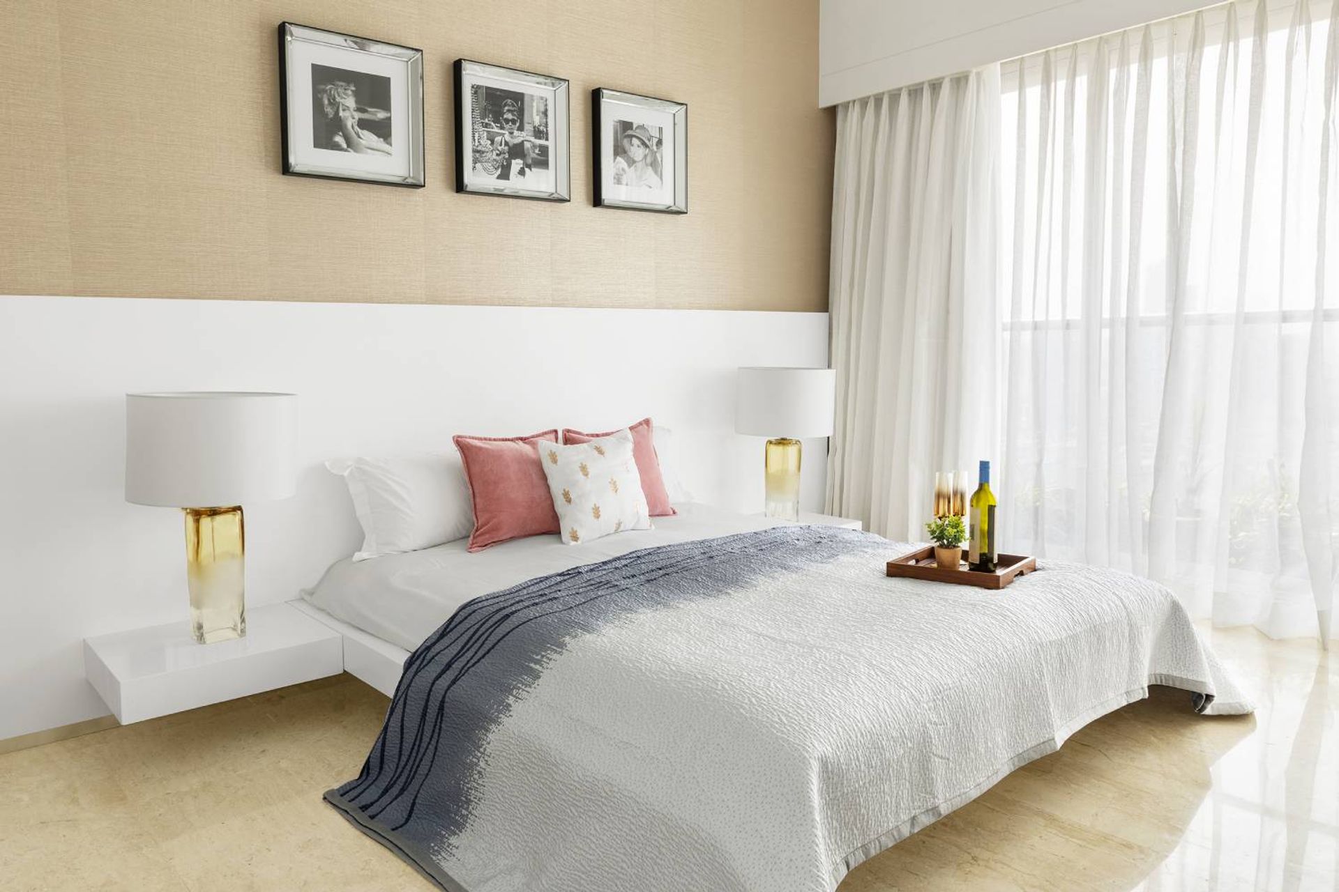 Warm and Contemporary 2BHK Mumbai Flat Design with Beige and White Walls and Chandelier | Livspace