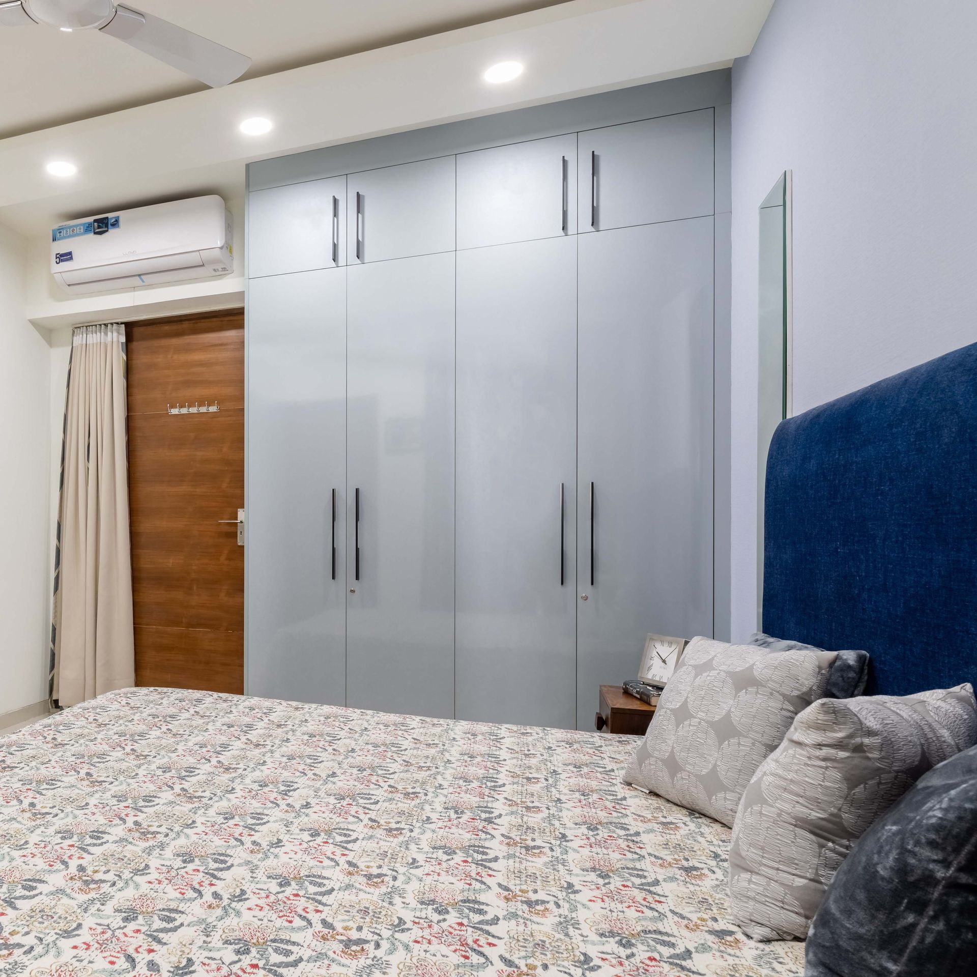Stylish Modern Silver Frost Glossy and Loft Wardrobe Design | Livspace
