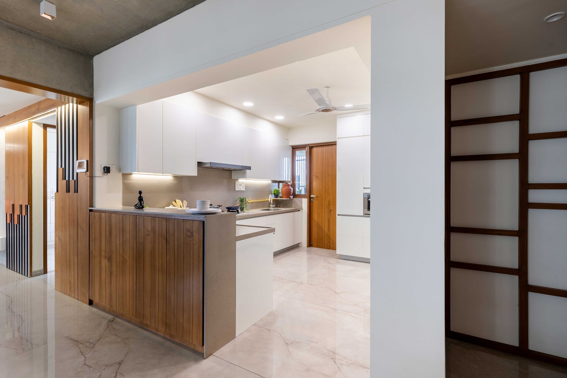 Spacious Kitchen Design With Profile Lighting | Livspace