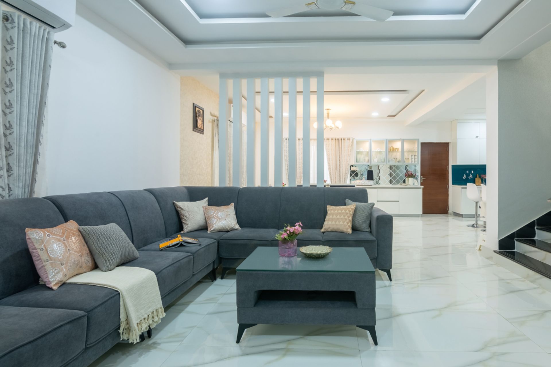 Spacious Living Room Design With A Rectangular Grey Center Table | Livspace