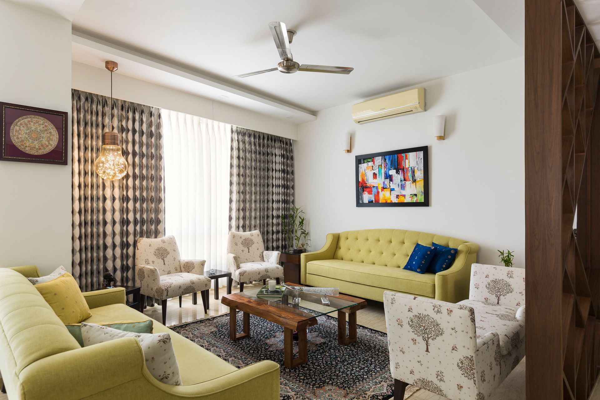 Gurgaon 2-BHK Flat Design With Yellow And White Patterned Living Room ...