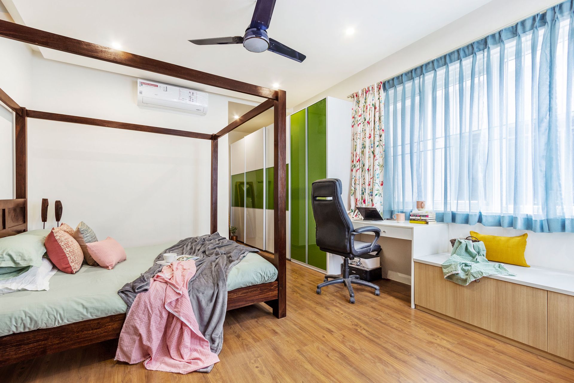 Master Bedroom With 4-Poster Wooden Bed And Green-White Sliding ...