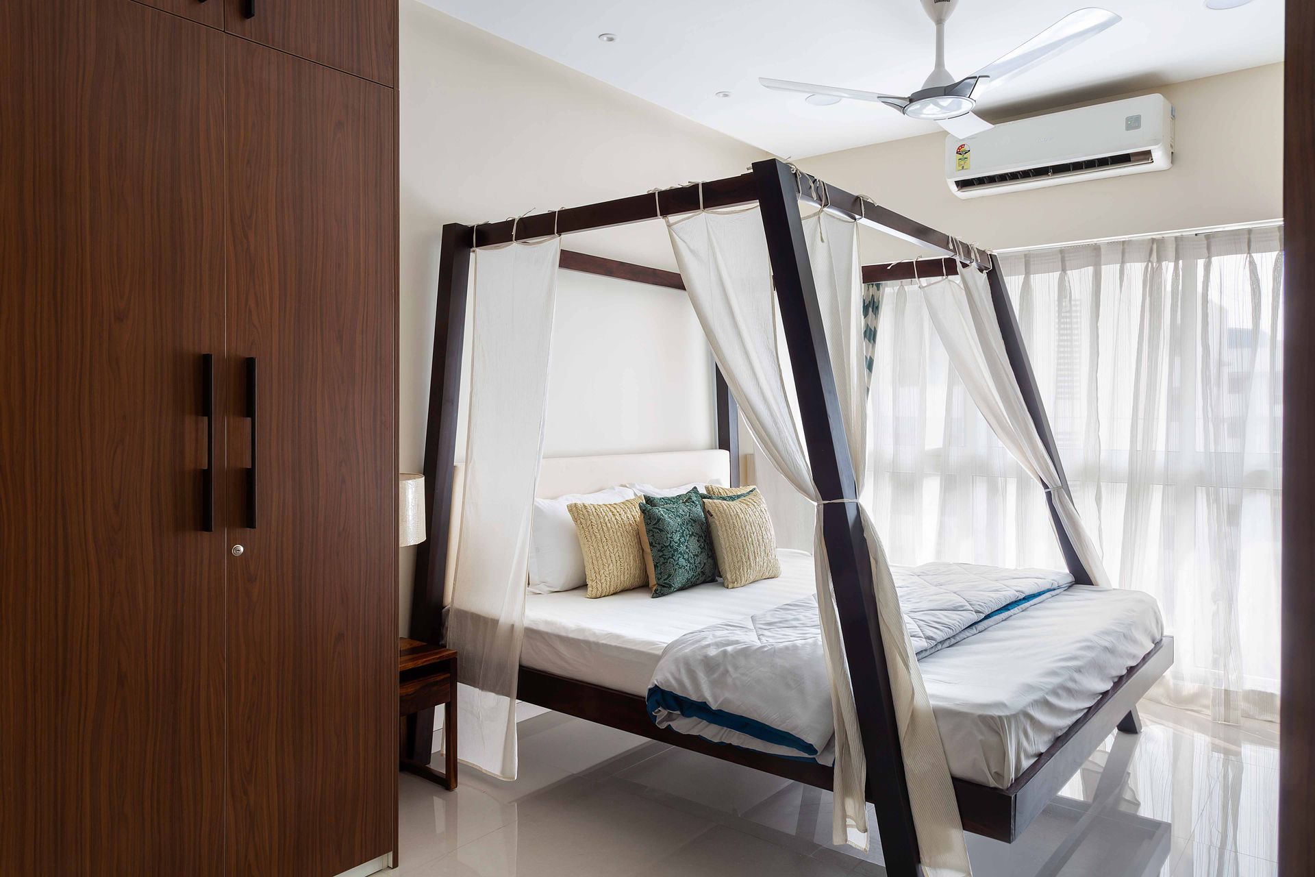 Guest Room Design With Wooden 4-Poster Bed | Livspace