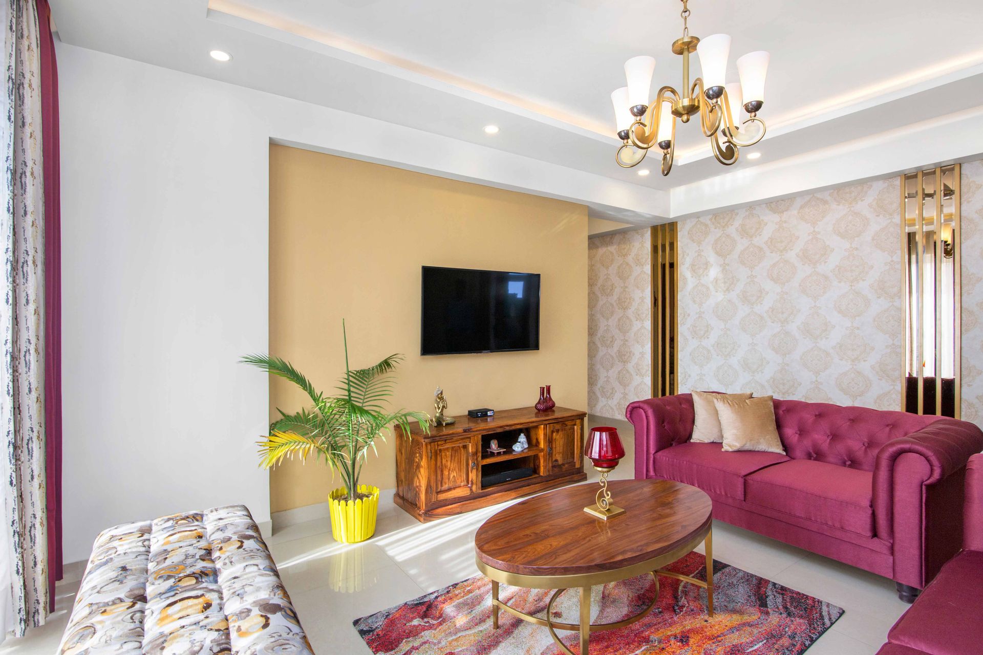 2-BHK Flat With L Shaped Magenta Living Room Design | Livspace