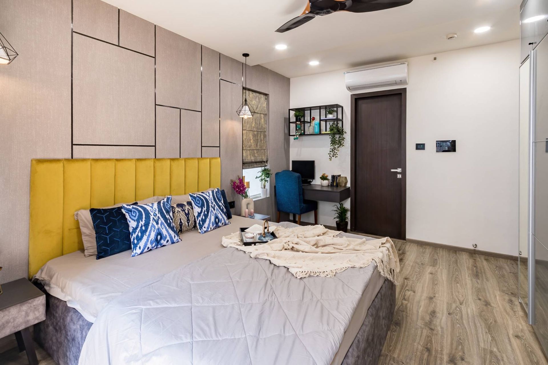 Spacious Guest Bedroom Design With Yellow Headboard | Livspace