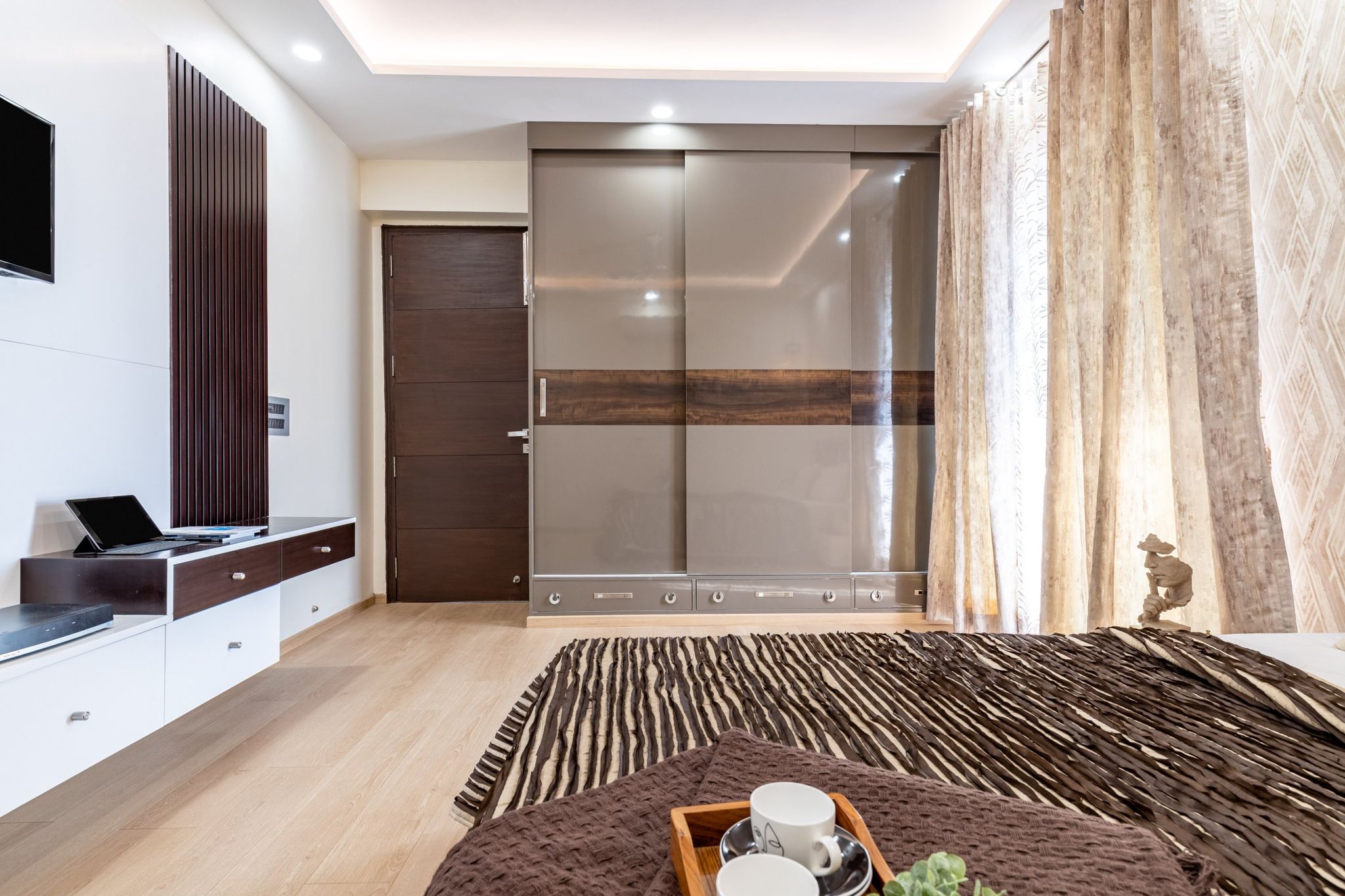 Spacious False Ceiling Design With Inverted Cove Lights | Livspace