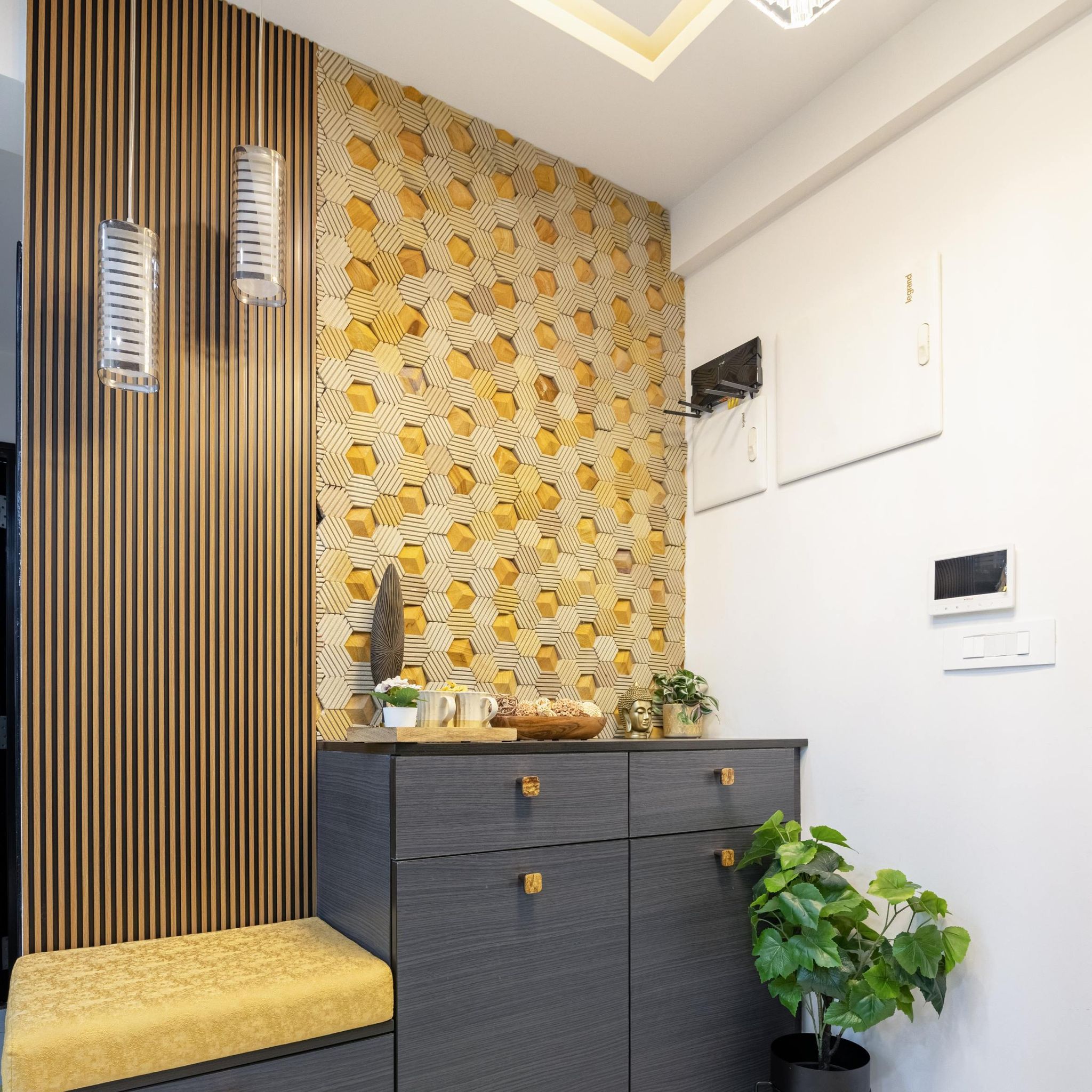 Wall Design With A Patterned Wall Panelling And Wooden Panels | Livspace