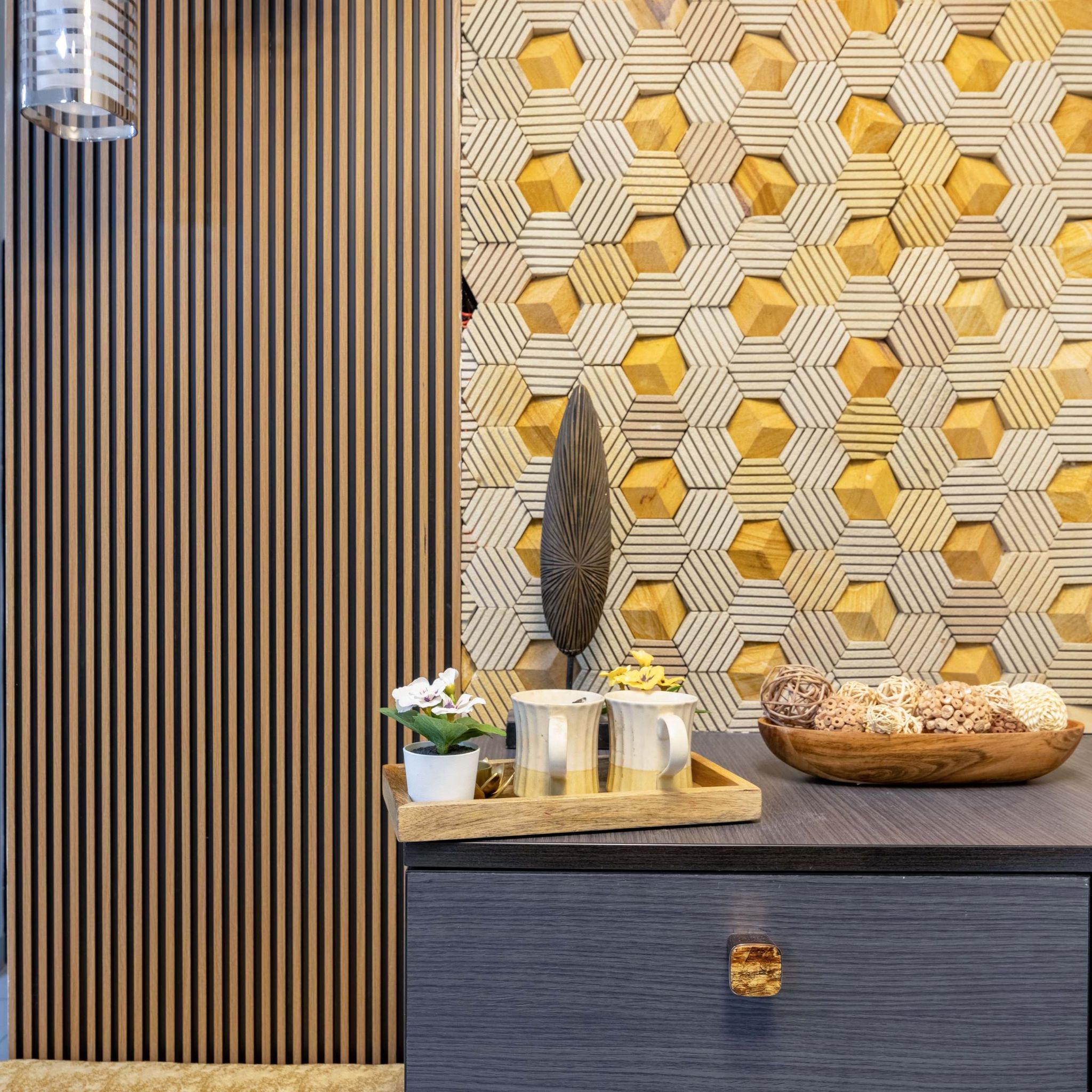 Wall Design With A Patterned Wall Panelling And Wooden Panels | Livspace
