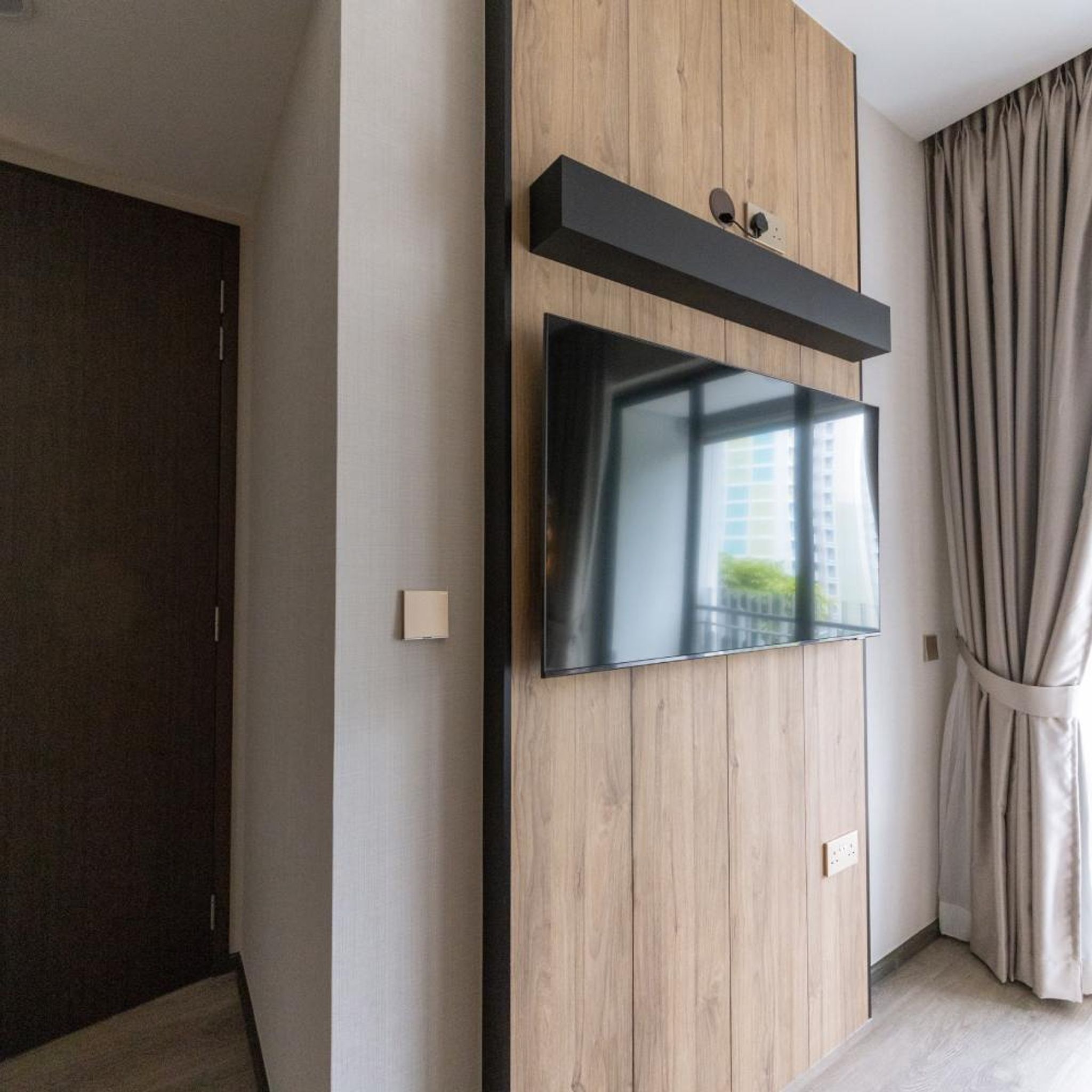 Compact TV Cabinet Design With A Black Ledge | Livspace