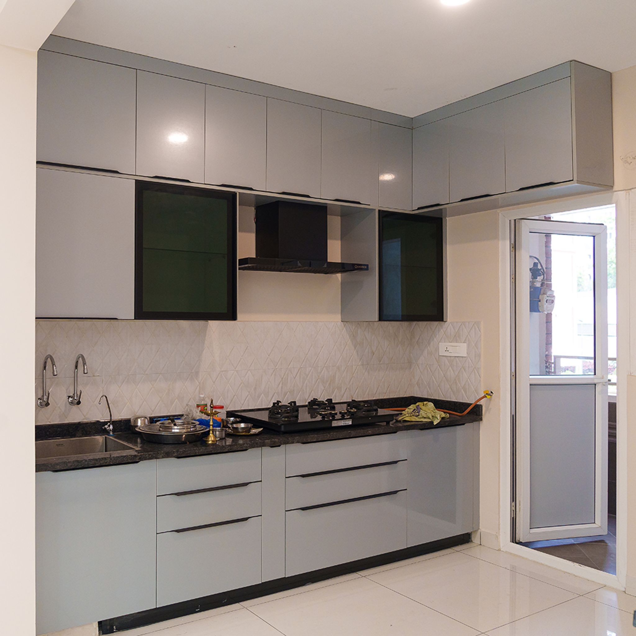 3BHK Interior Design in Hyderabad With Straight Kitchen and Storage ...