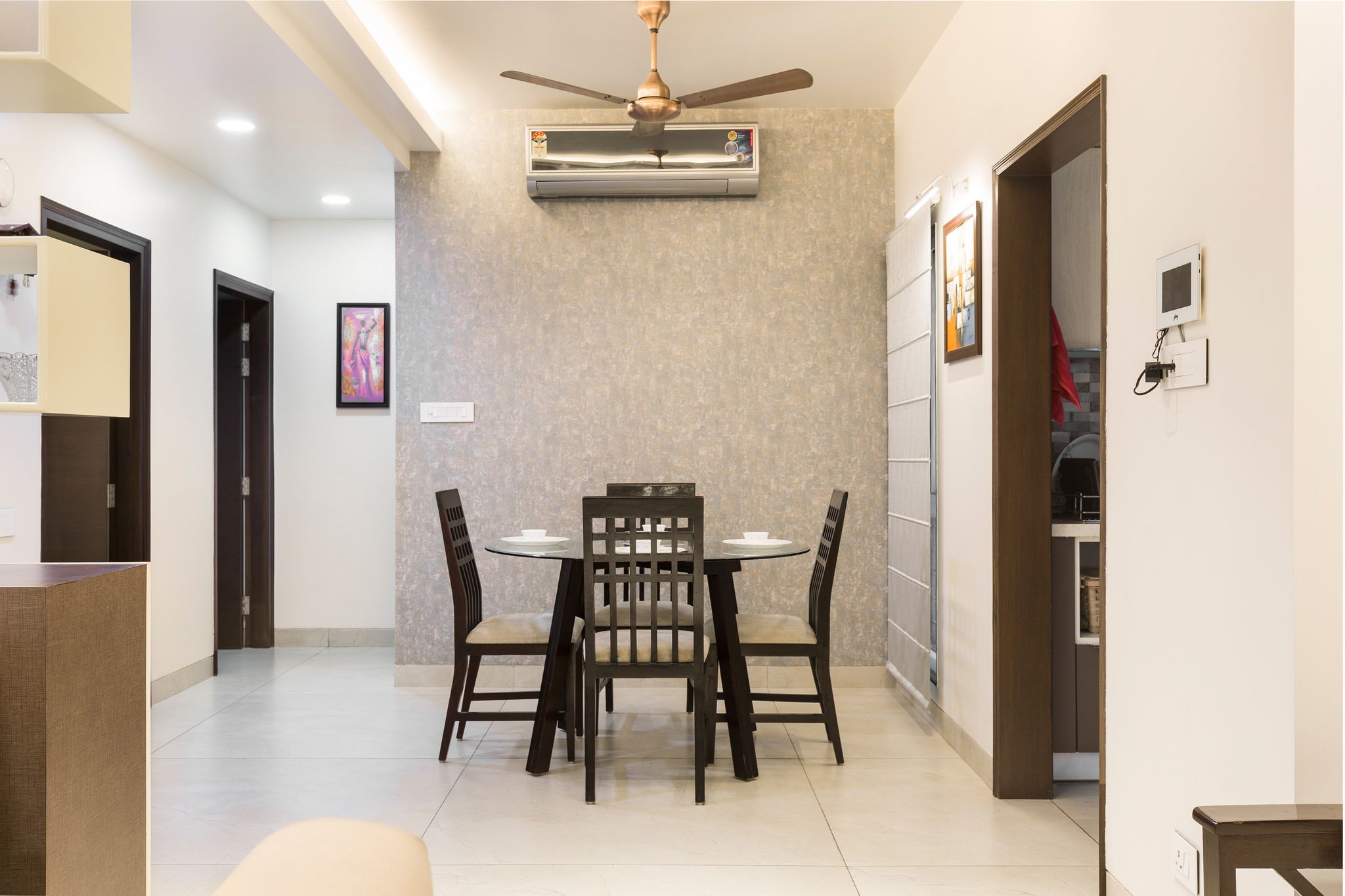 Compact Dining Hall Design With A Glass Tabletop And Wooden Chairs ...