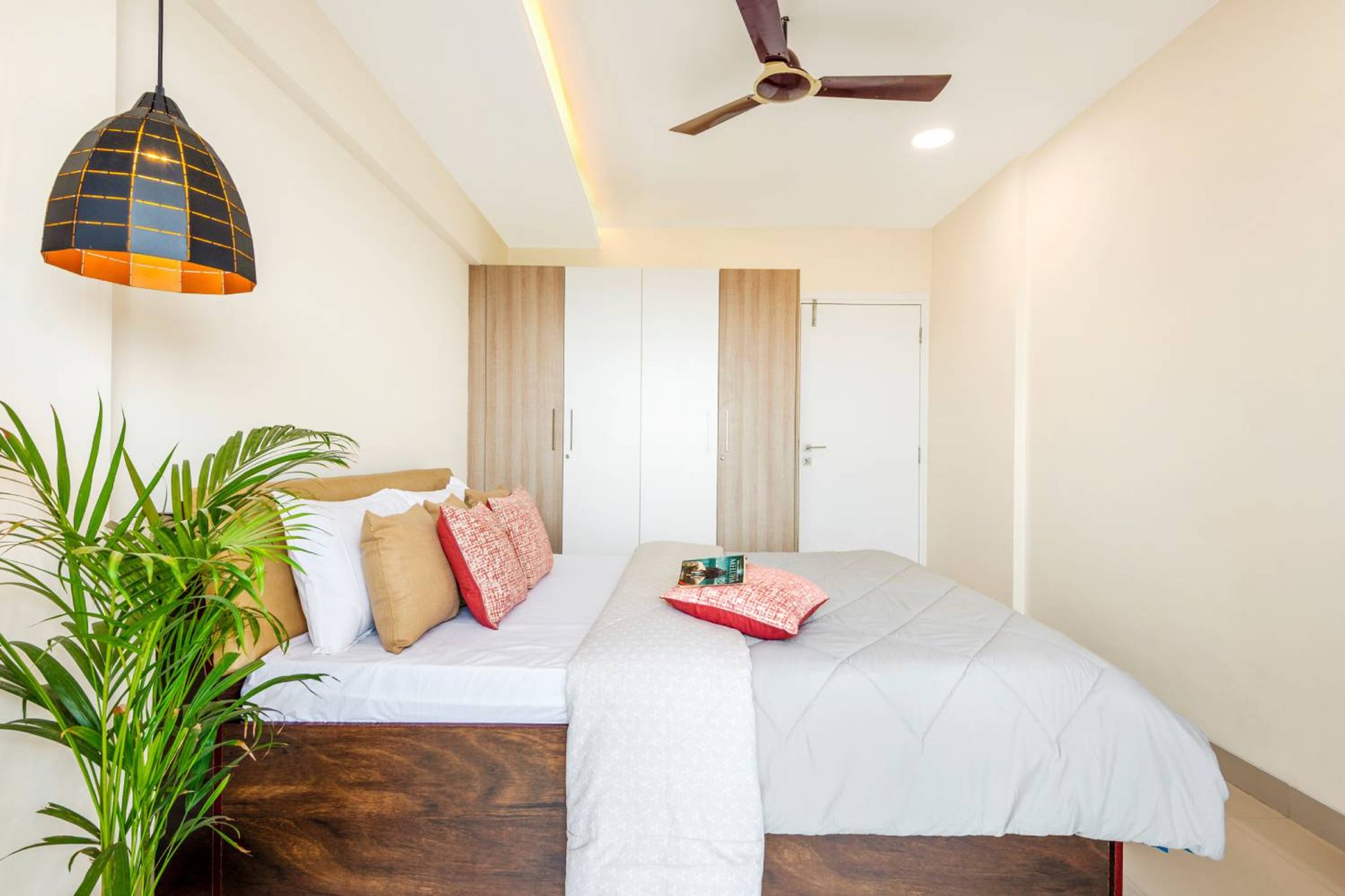 Stylish 2BHK Contemporary Pune Flat Design with Swing Wardrobe and Brick Accent Wall | Livspace