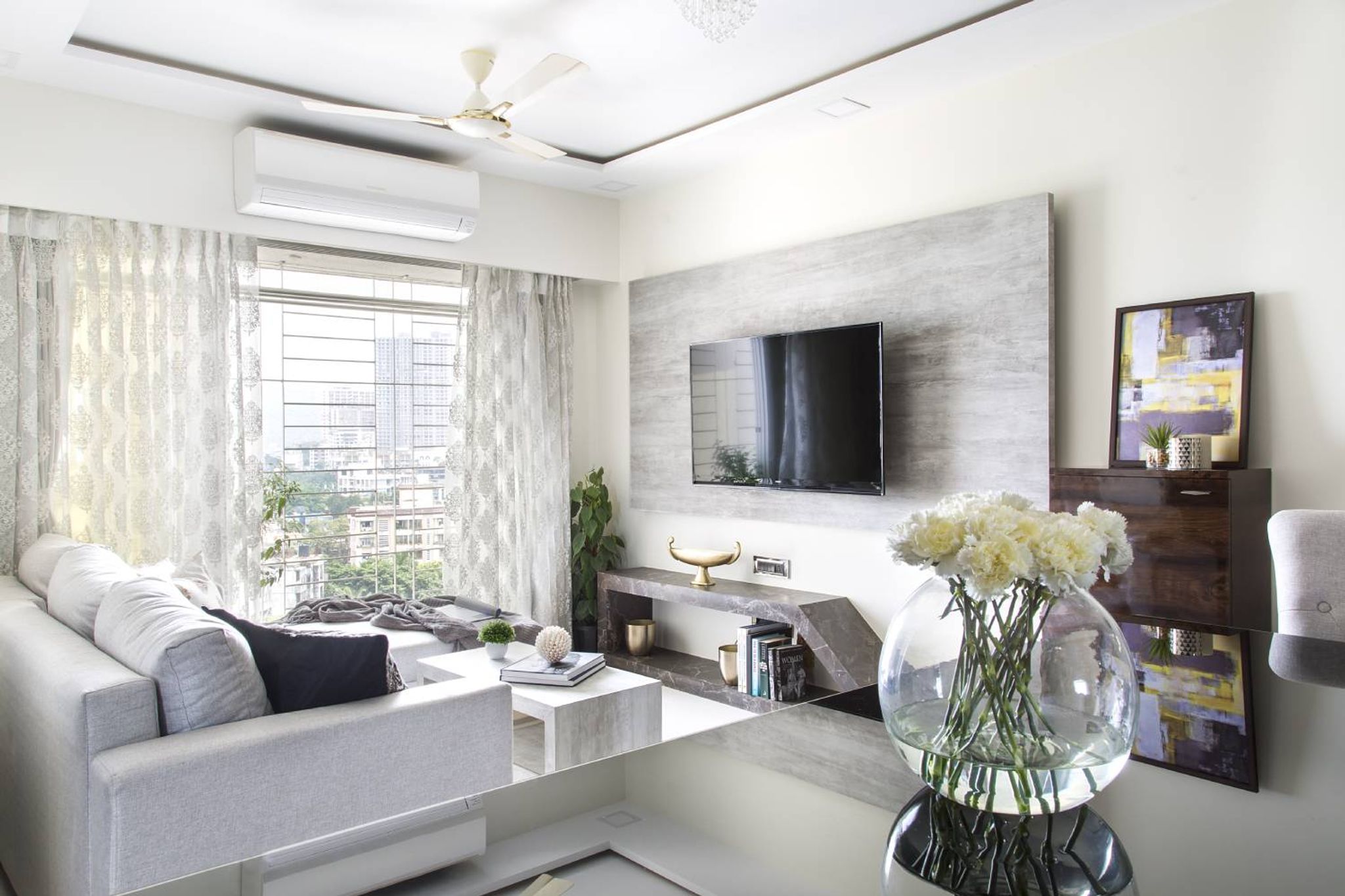 2BHK Mumbai Flat Contemporary Design with L-Shaped Sofa and Floral ...