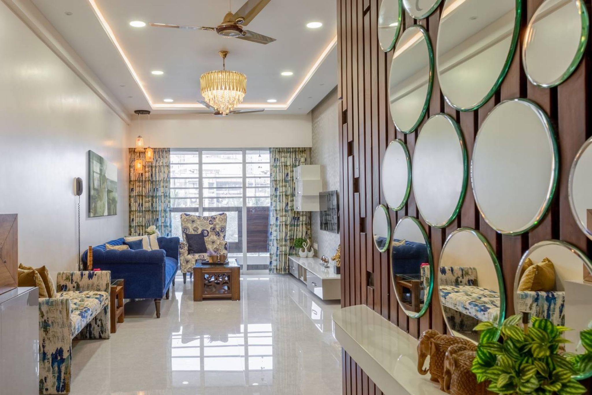 2BHK Mumbai Flat Modern Design with Blue Sofa, Floral Accent Chair, and ...