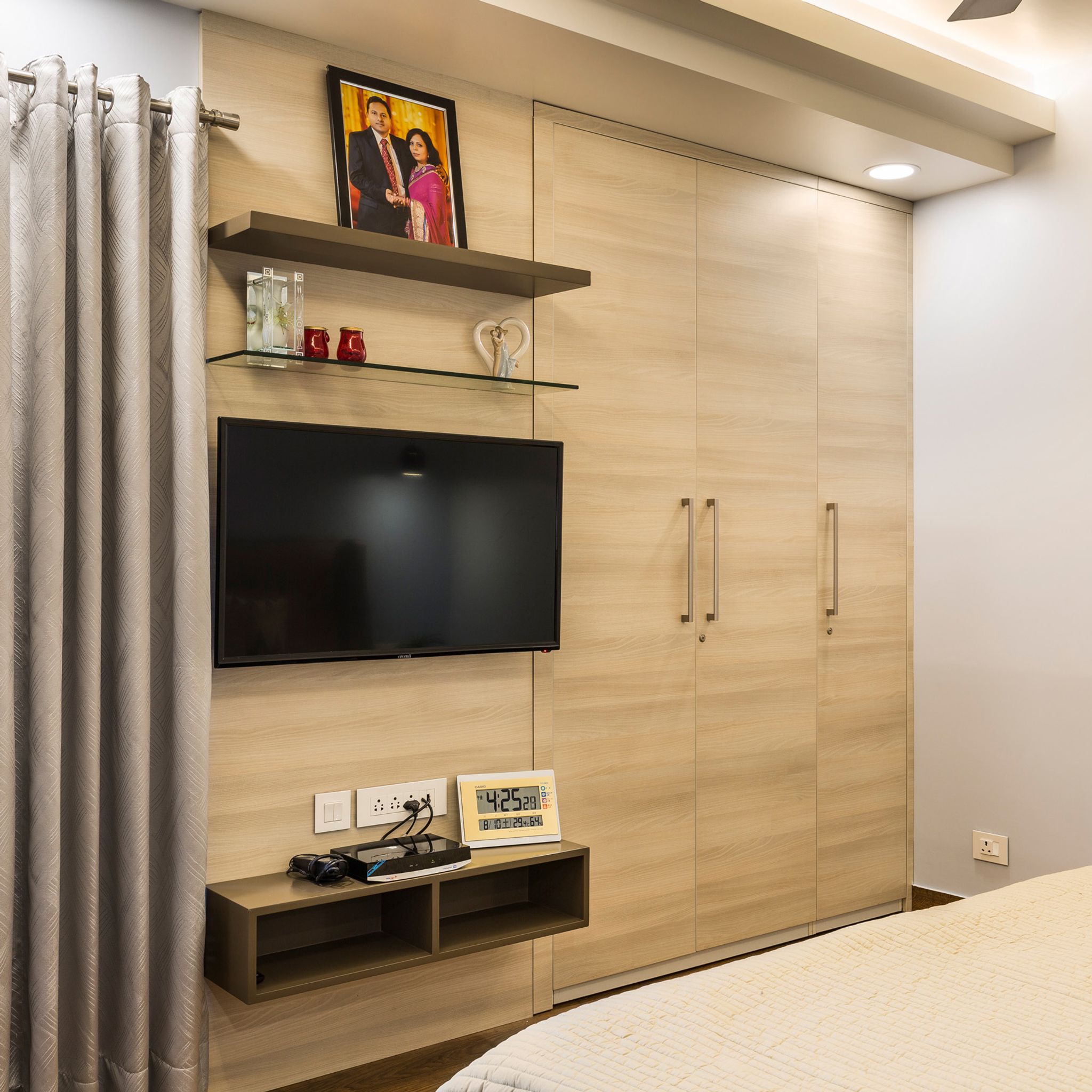 Tan Wall-Mounted TV Unit Design | Livspace