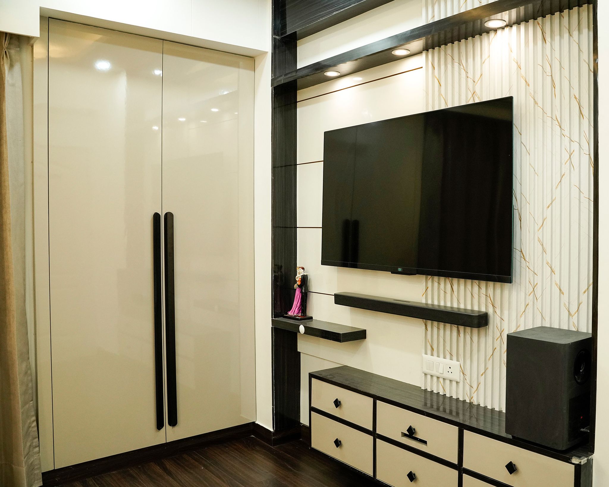 Beige and Wood Modern TV Unit Design with Vertical Fluted Panels | Livspace