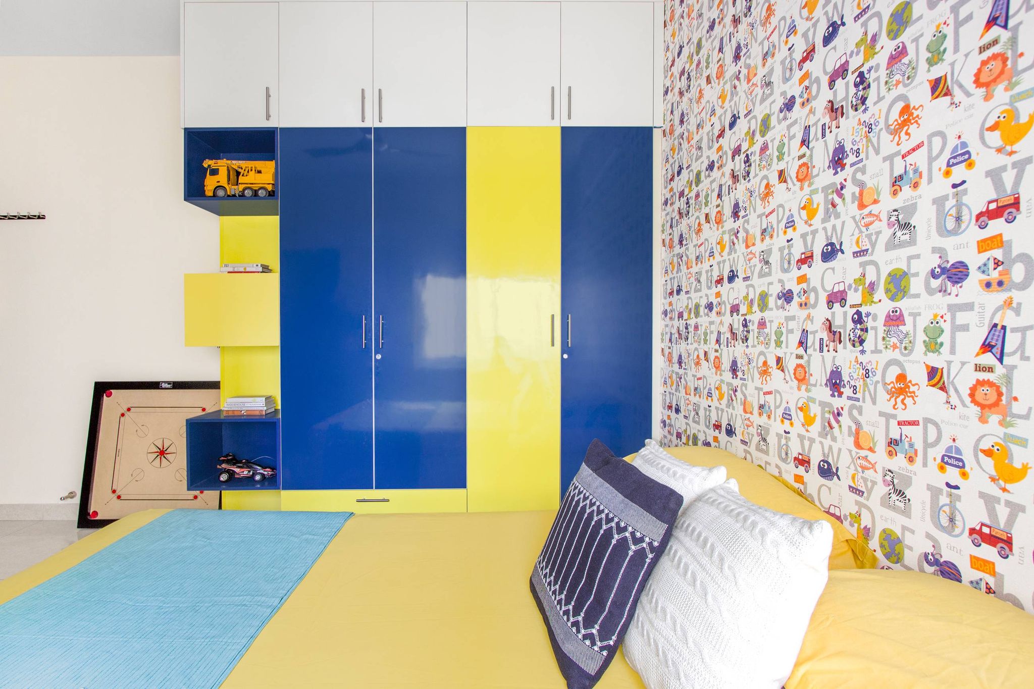 Kids Room Design With Full Wall Wardrobe And Open Shelves | Livspace