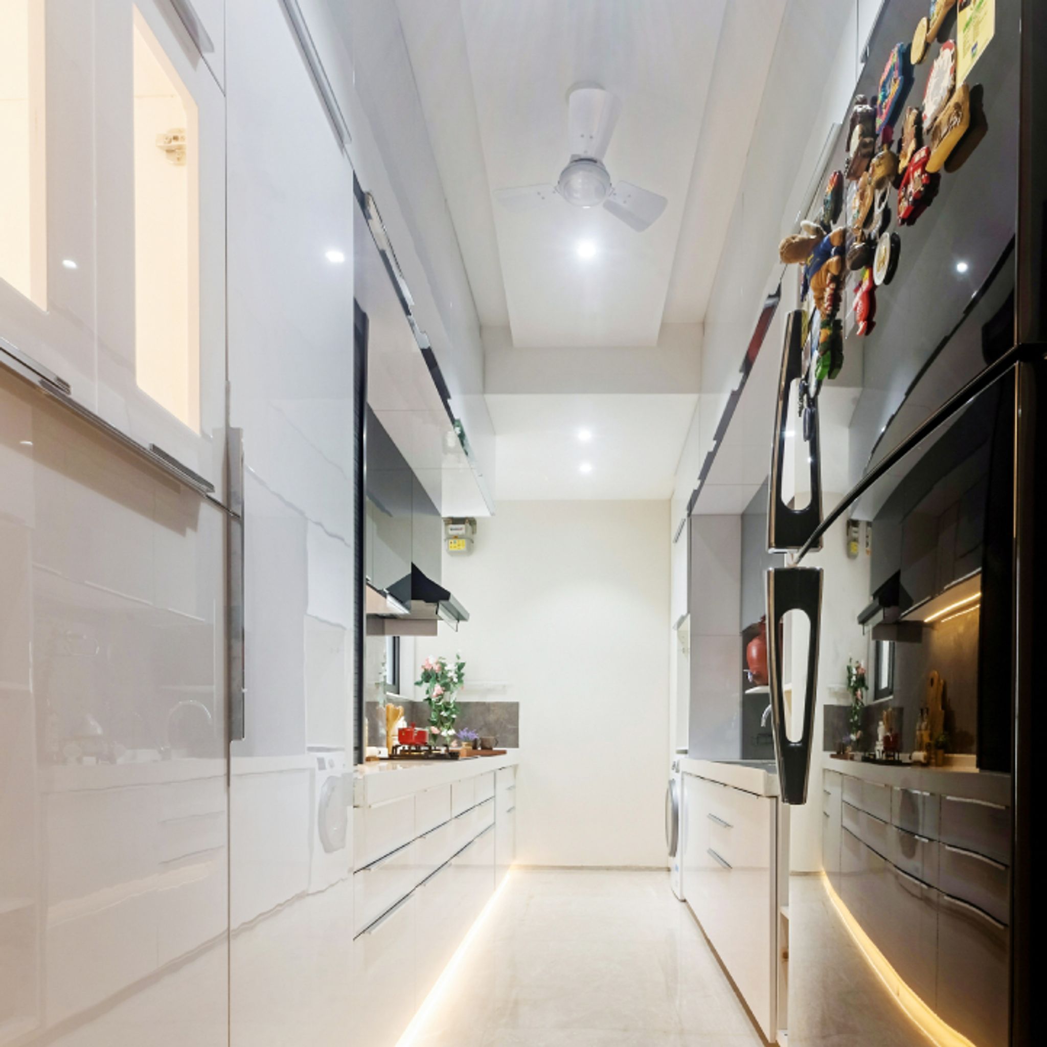 Modular Parallel Kitchen Design With Frosty White Cabinets And Beige ...