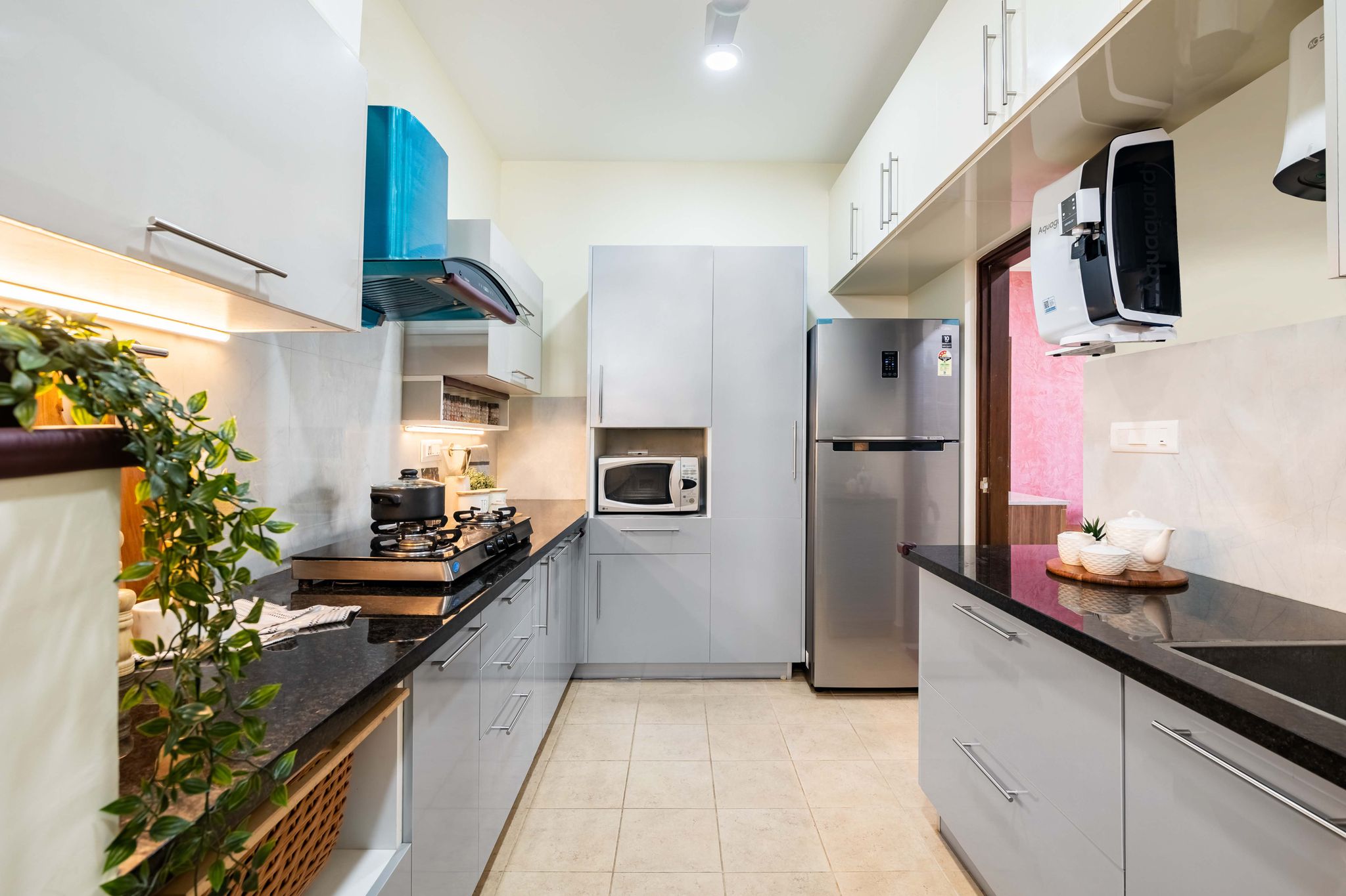 Grey And White Spacious Modular Kitchen Design | Livspace