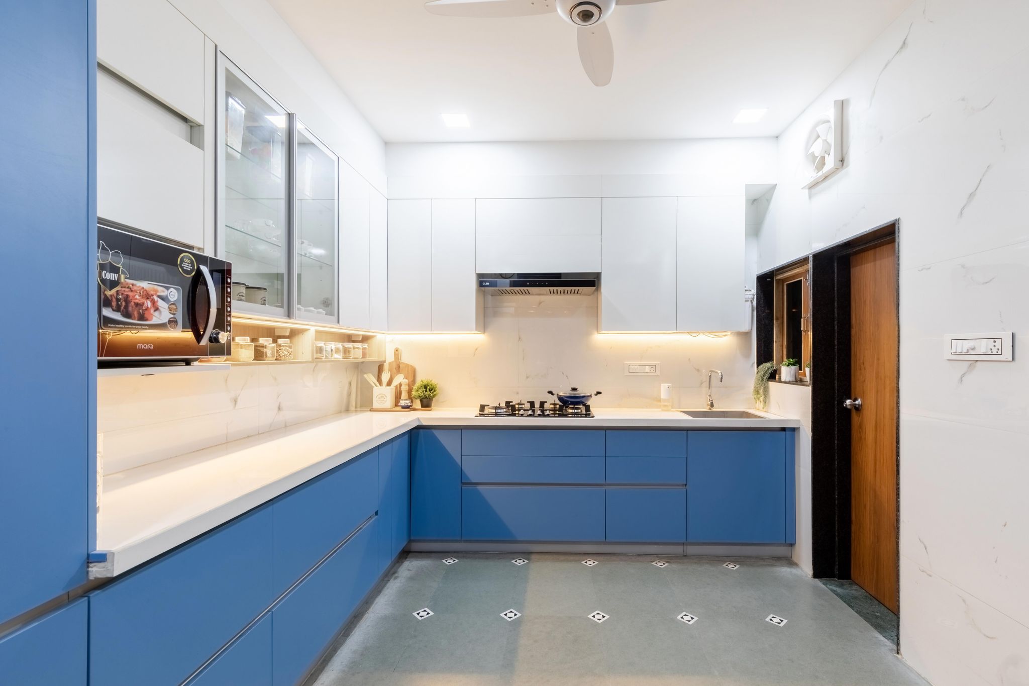 Blue And White Spacious Kitchen Design | Livspace