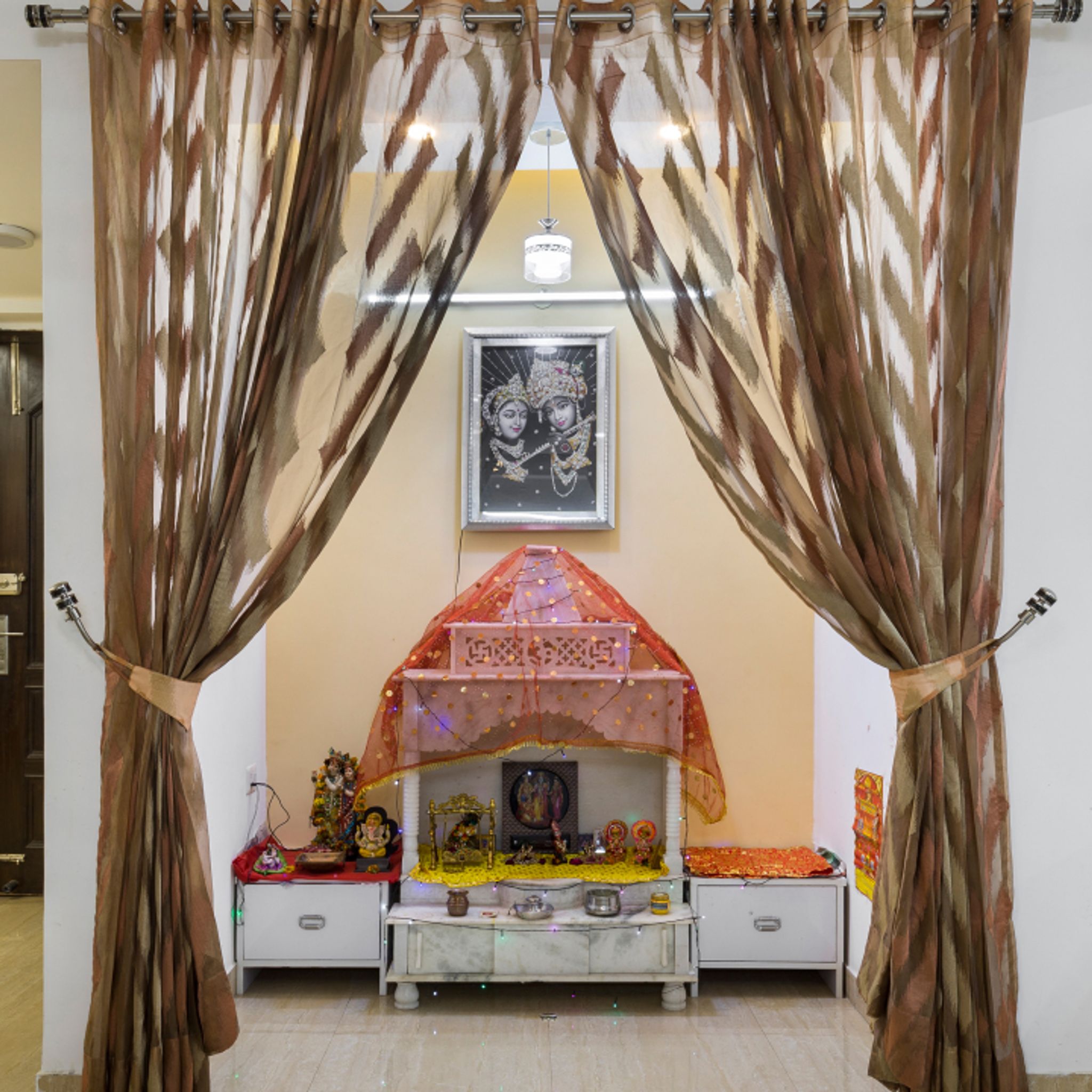 Floor-Mounted Pooja Room Design With Metallic Wall Paint | Livspace