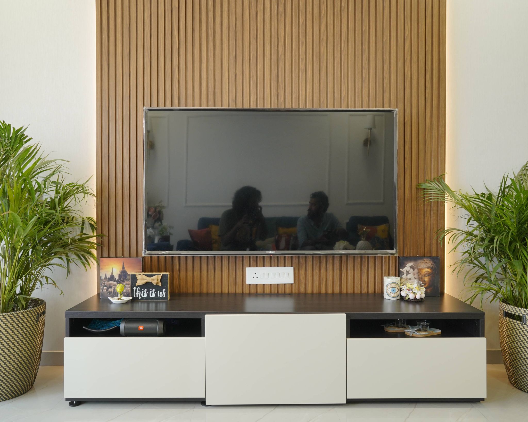 White TV Unit With Wooden Planks On The Back Wall | Livspace