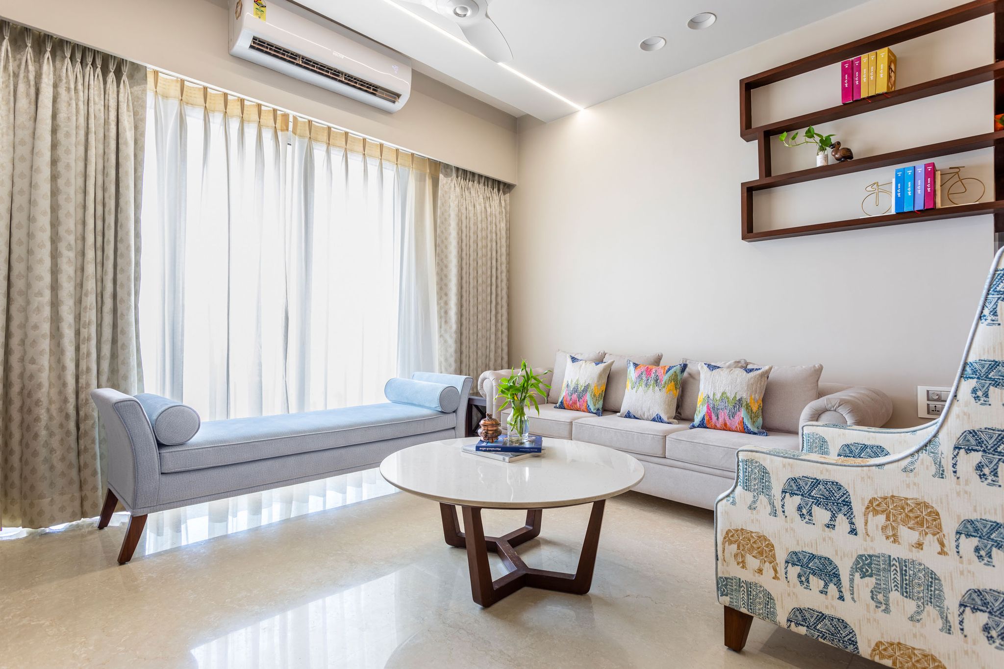 Compact Living Room Design With L Shaped Multicoloured Sofa Set And ...