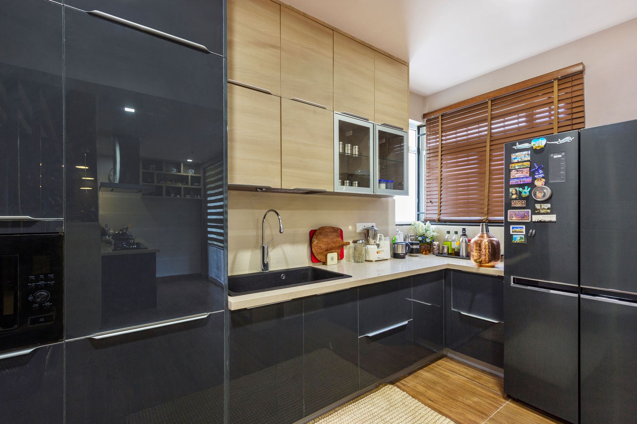 Modular Island Kitchen Design With Dark Grey And Acacia Cabinets | Livspace