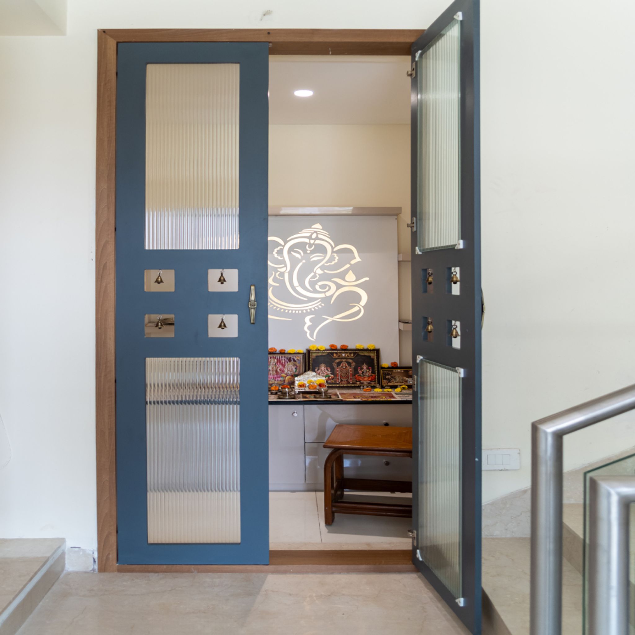 Blue and White Pooja Room Design with High Gloss Laminate Shutters and ...