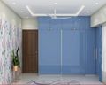 Spacious Off-White Wardrobe Design With Study Table | Livspace