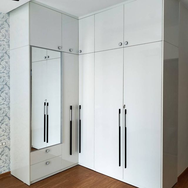Modern 5 Door Swing Wardrobe Design in White Suede Finish | Livspace