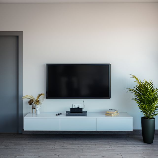 Spacious TV Unit Design With Wooden Flooring | Livspace