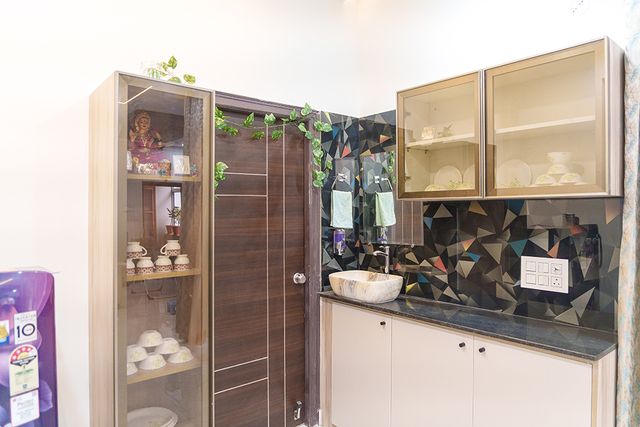 Contemporary Crockery Unit Design in White With Glass Cabinets | Livspace