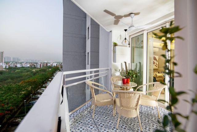 Spacious Balcony Design With 4-Seater Table And Moroccan Floor Tiling - 8X8 Ft | Livspace