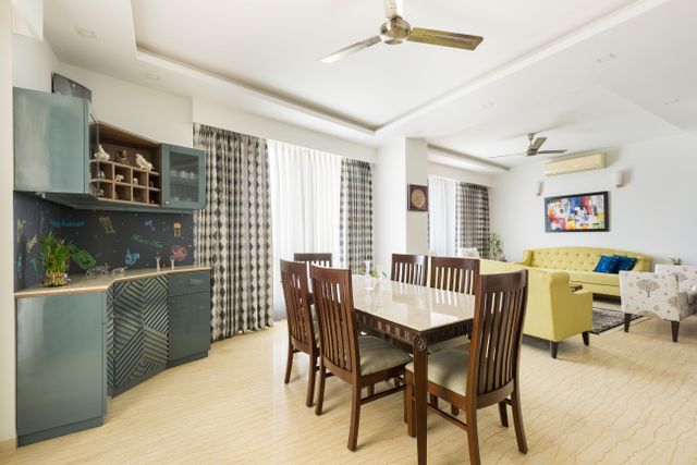 Gurgaon 2-BHK Flat Design With Yellow And White Patterned Living Room ...