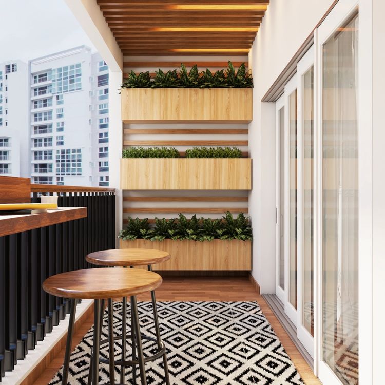 Compact Balcony Design With Wooden Table and Wall Planters | Livspace